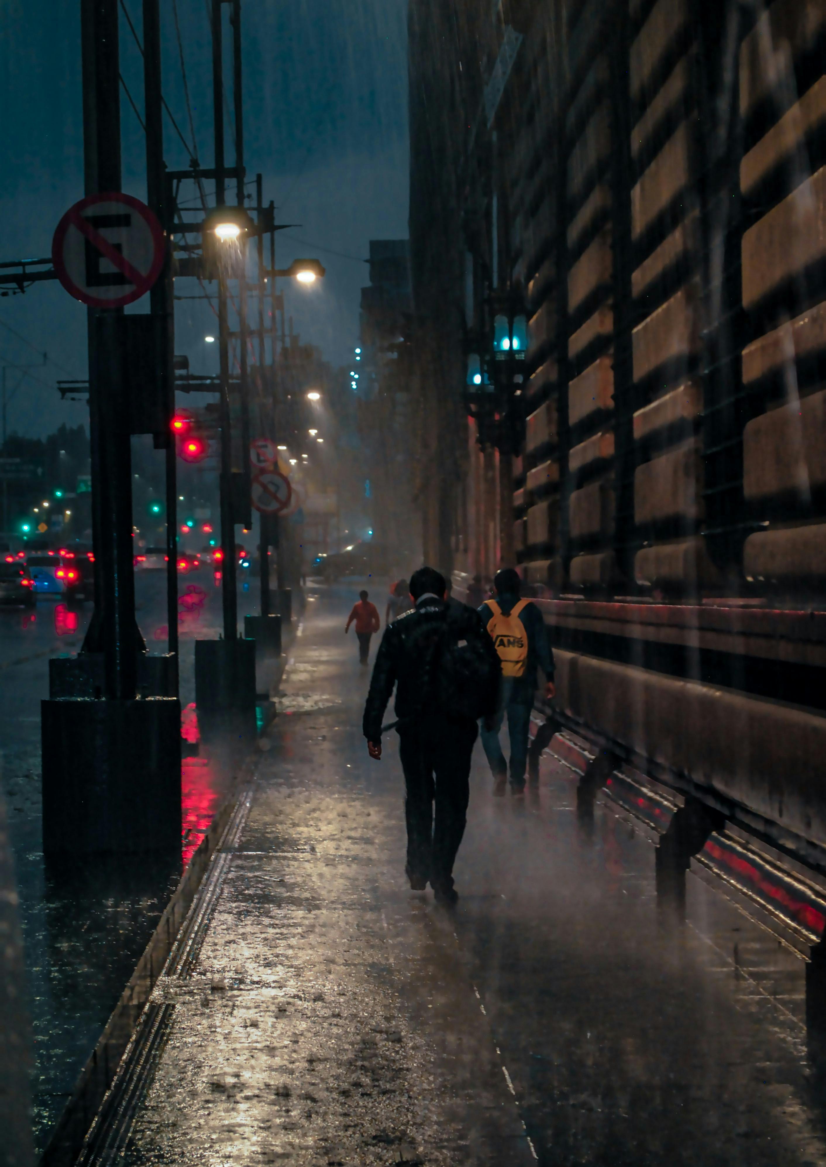Back View of a Man Walking on a Street · Free Stock Photo