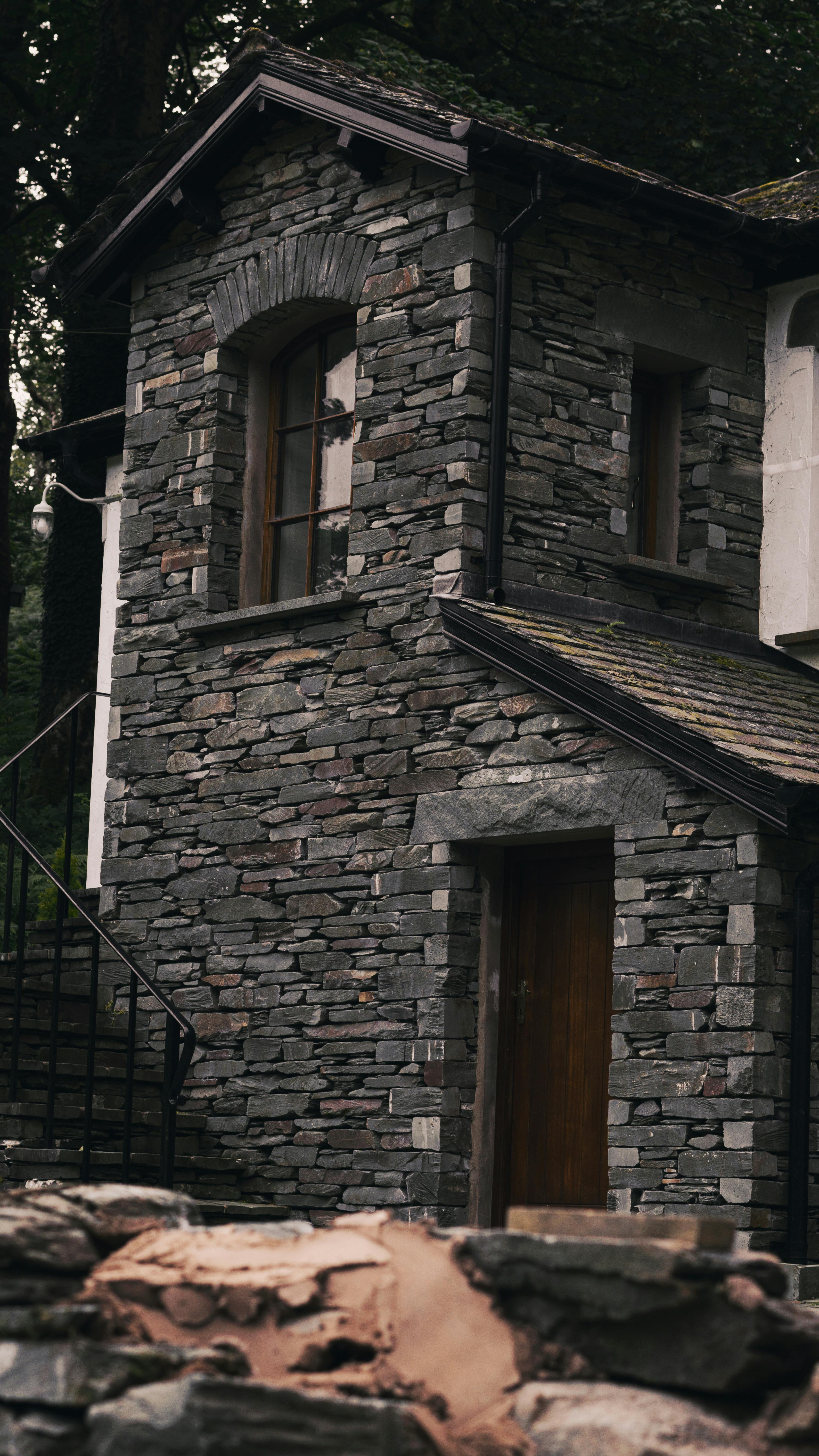 Rock House with Wooden Door and Glass Window · Free Stock Photo