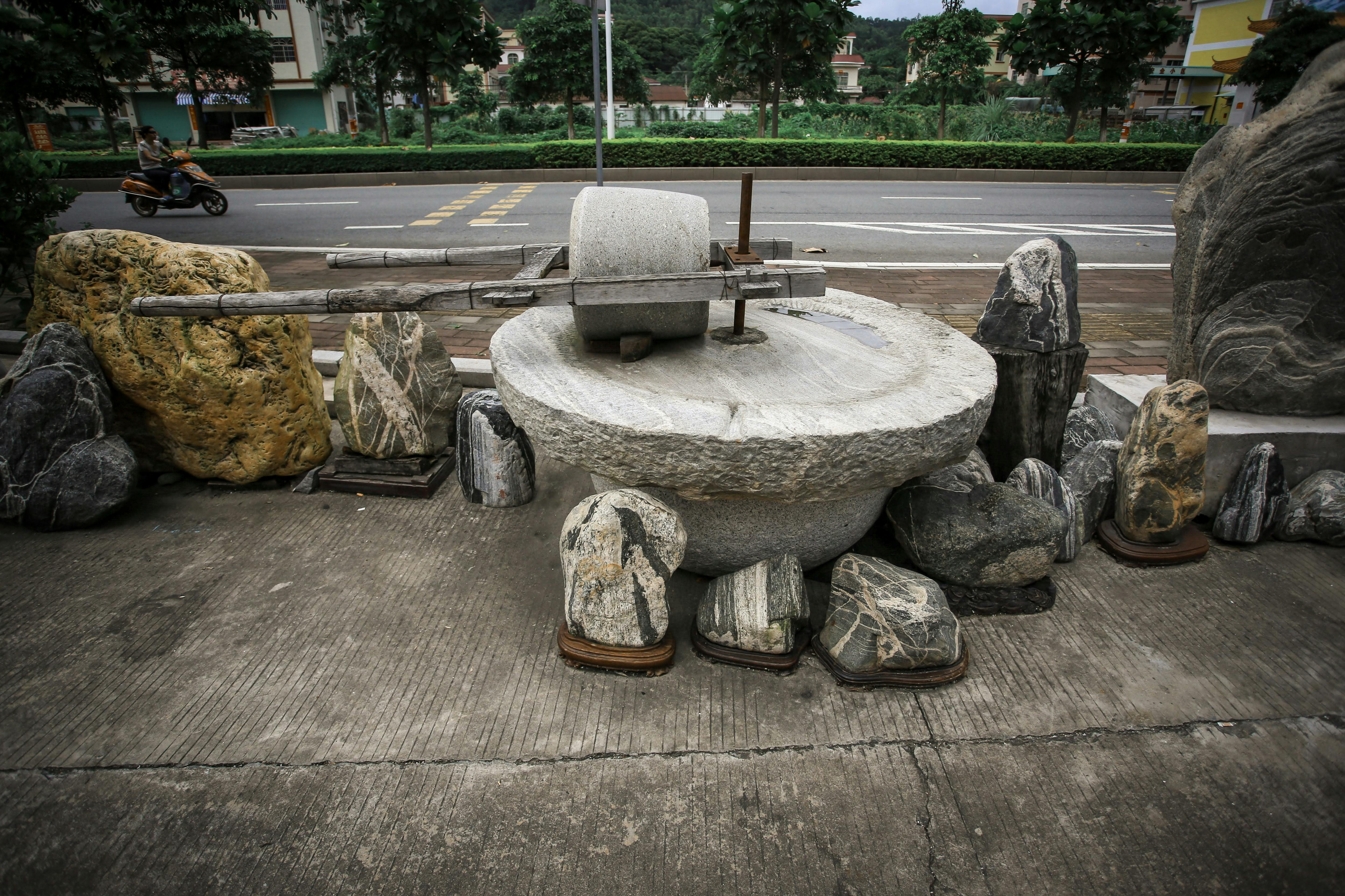Stone Cider Press on Gray Concrete Floor · Free Stock Photo