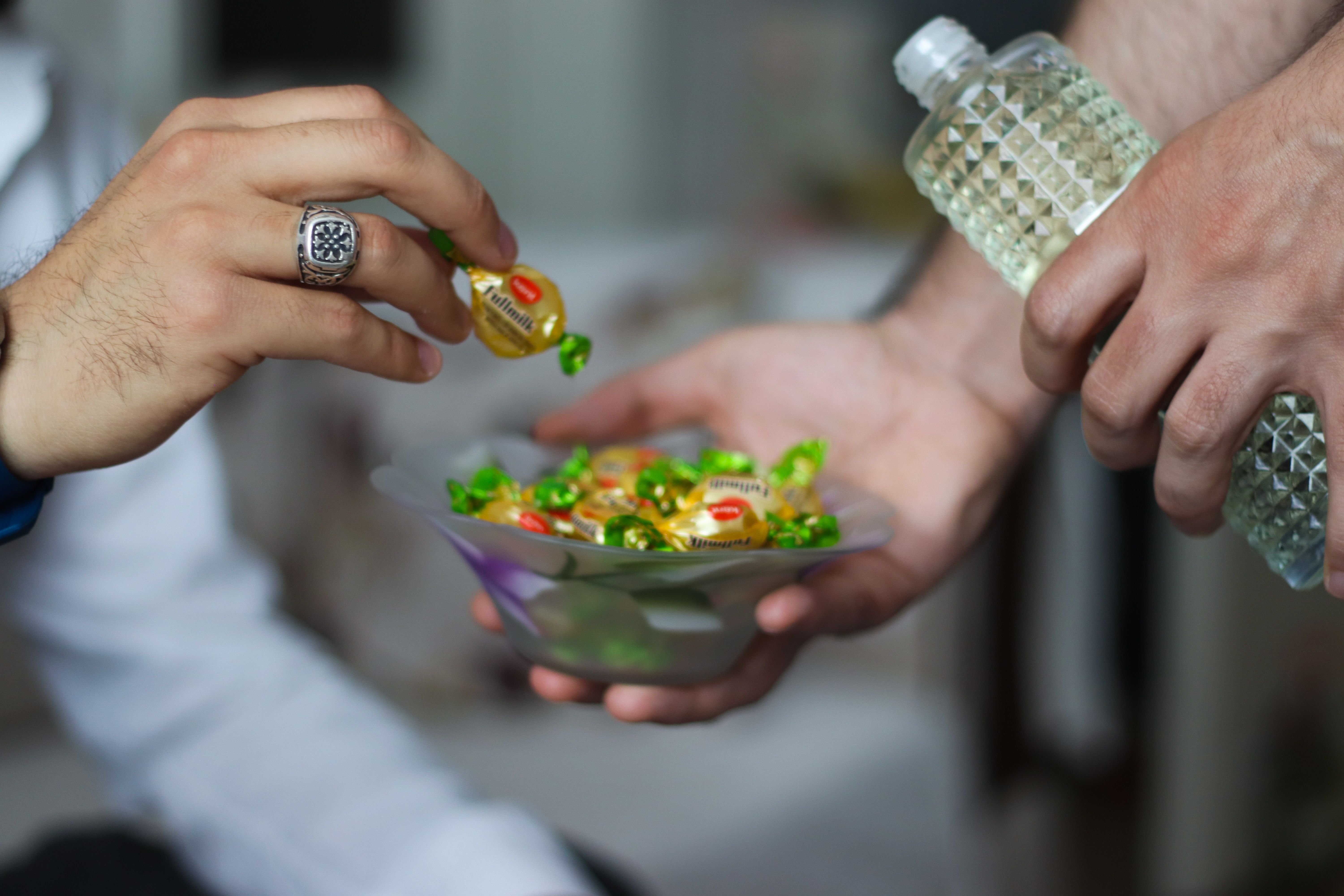 Person Holding a Bowl of Candies · Free Stock Photo