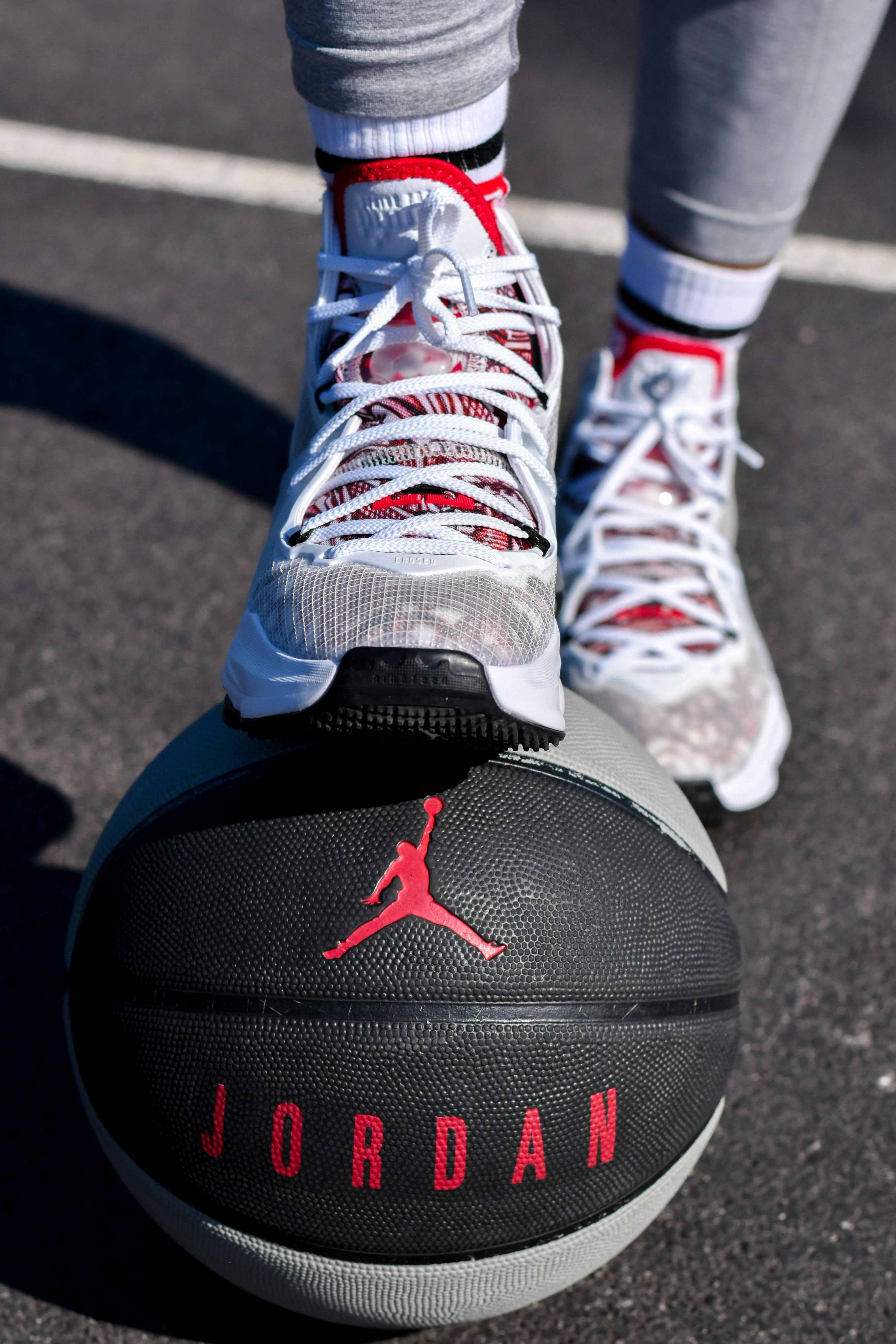 Person Stepping on a Basketball · Free Stock Photo