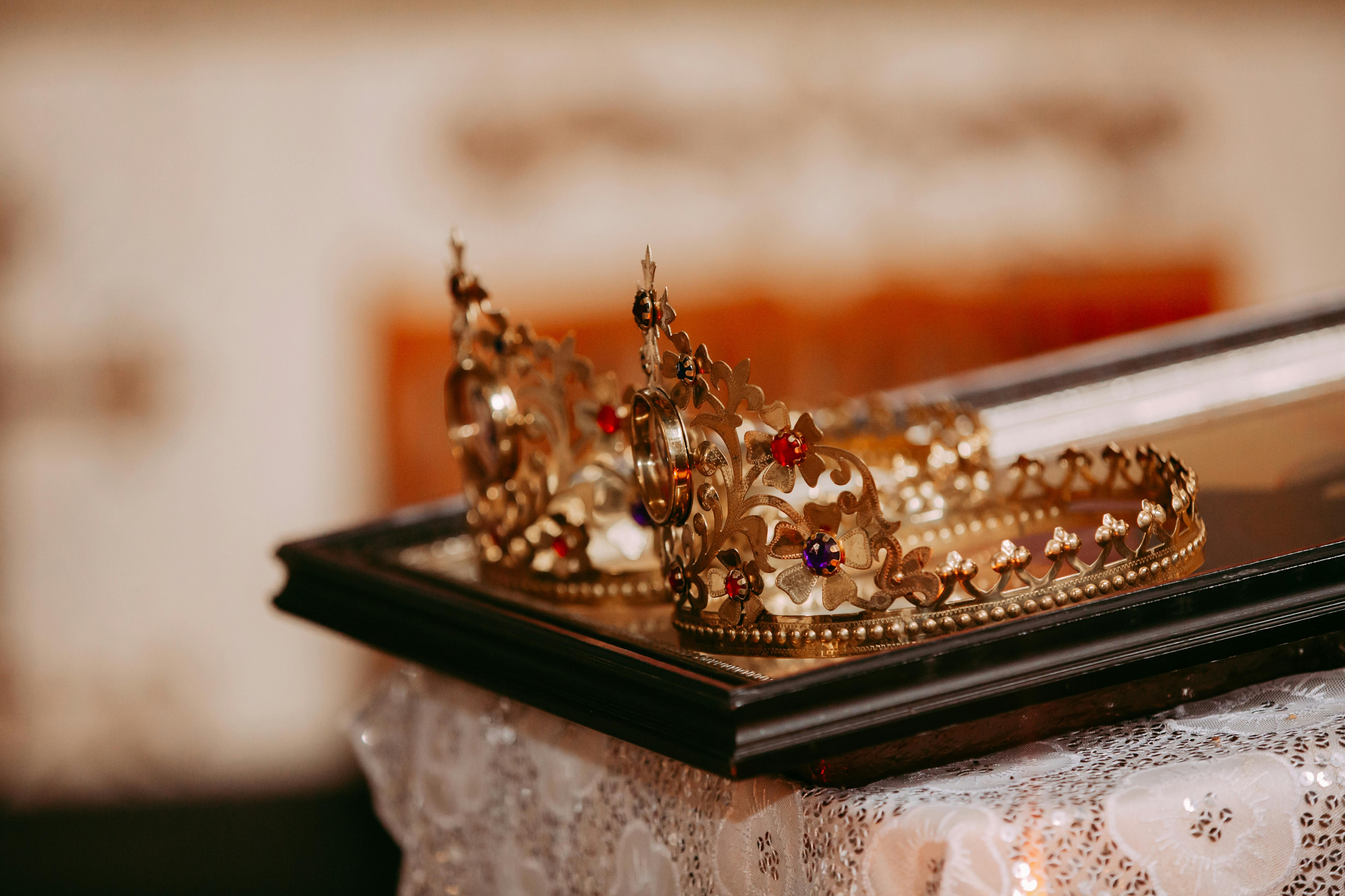 A Woman Holding a Tiara · Free Stock Photo