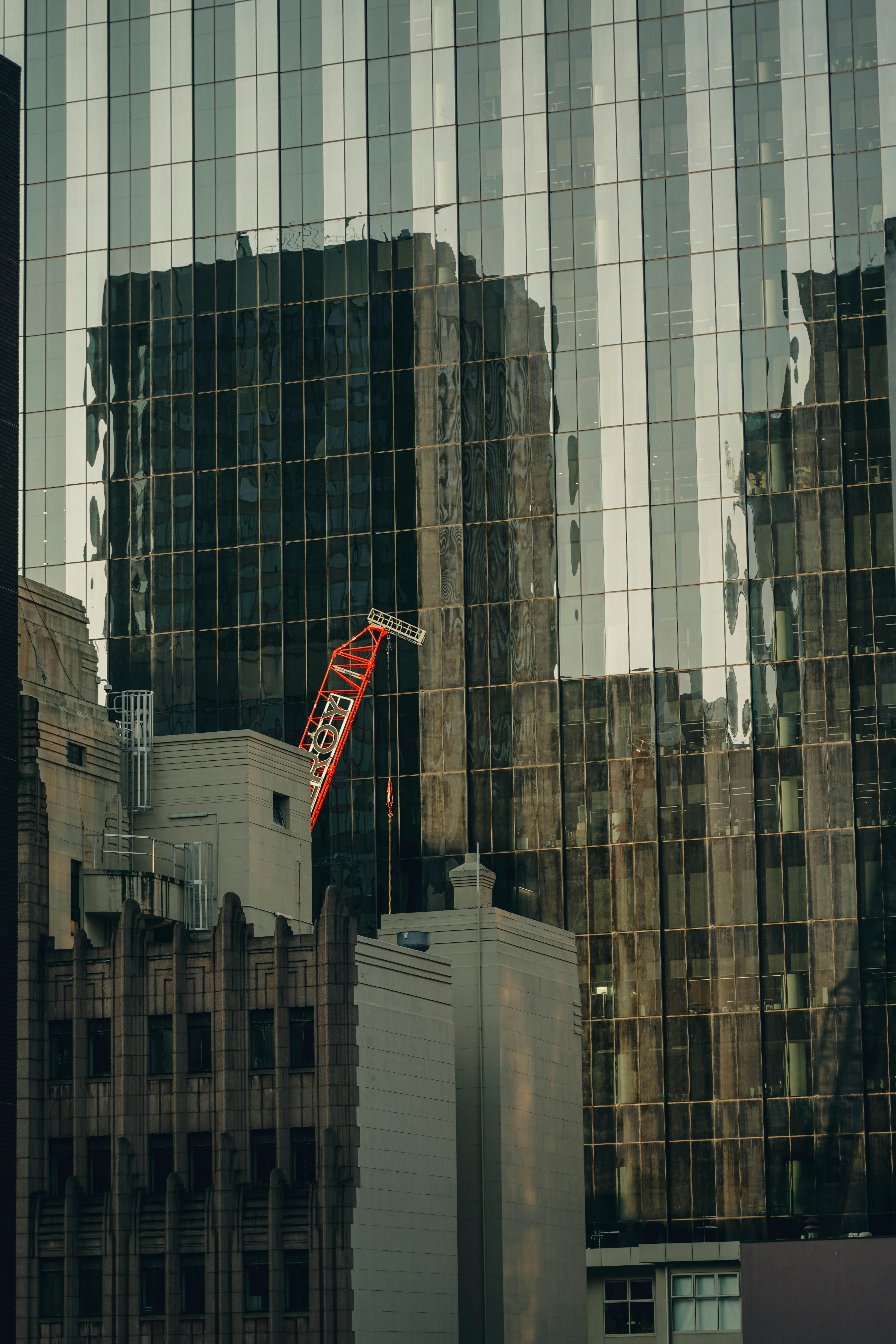Reflections of Buildings on a Glass Building · Free Stock Photo