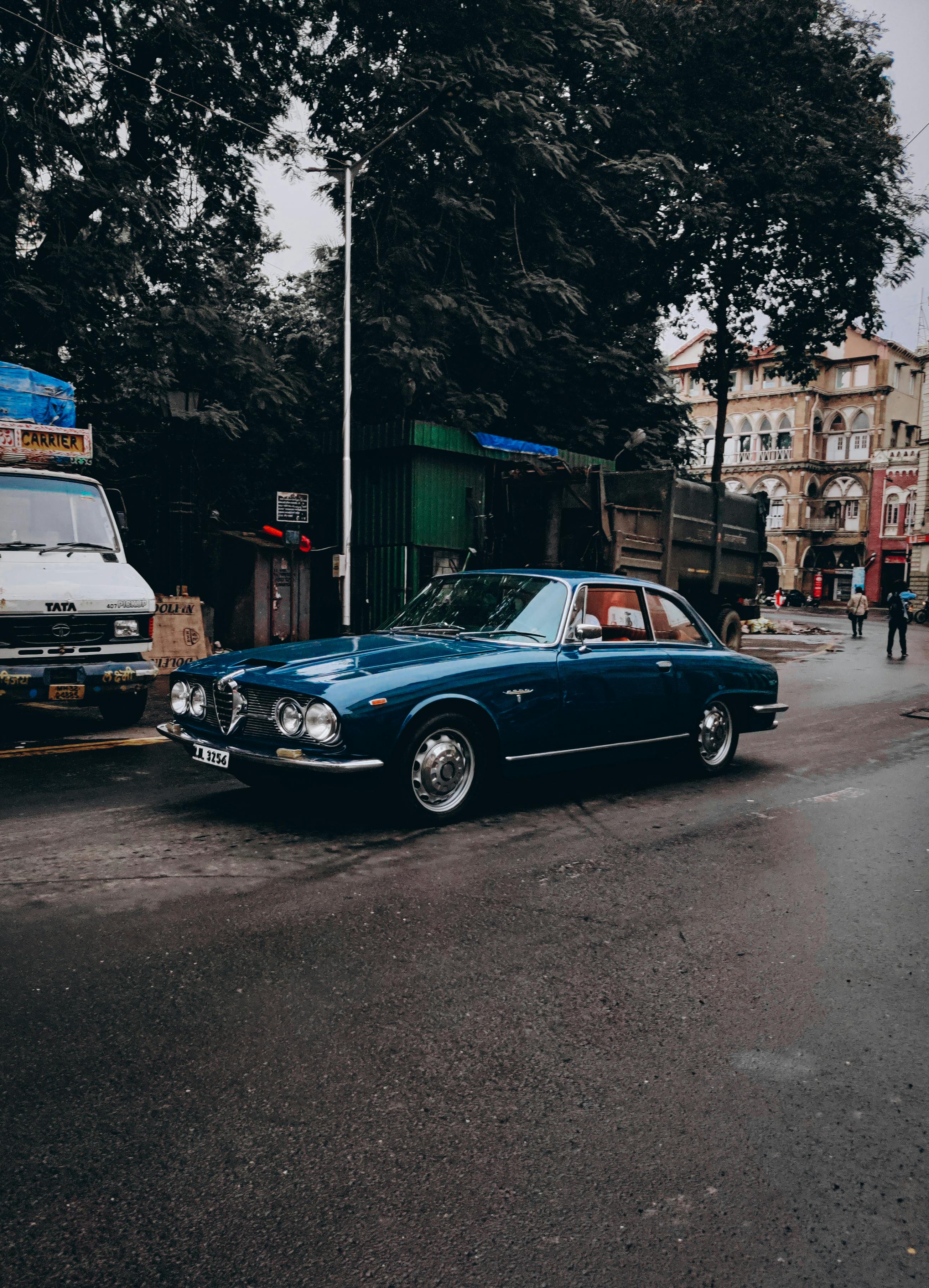 Volvo Amazon among Cars on Street · Free Stock Photo