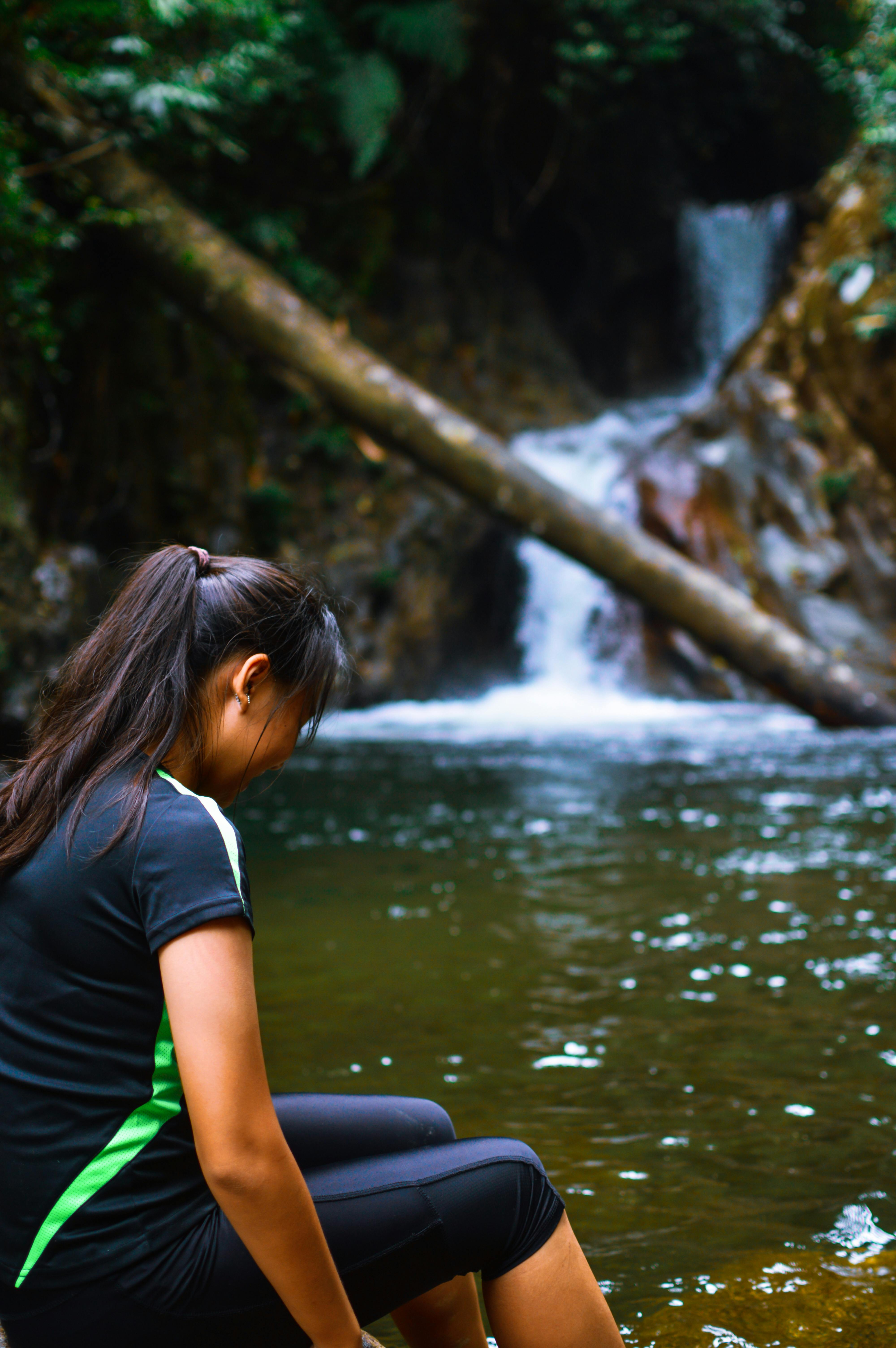 Woman Sitting Rock · Free Stock Photo