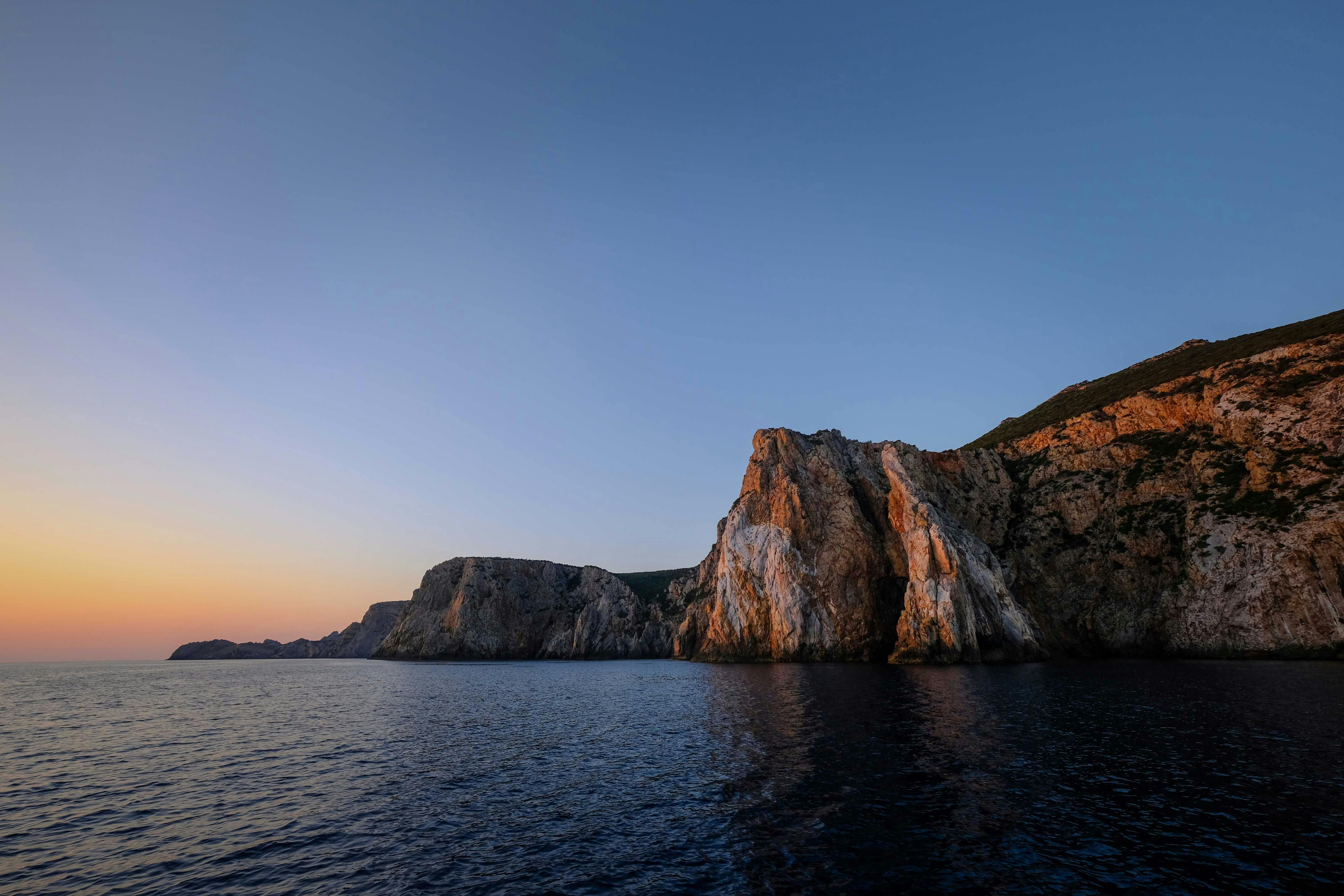 Scenic View of a Cliff at Sunset · Free Stock Photo