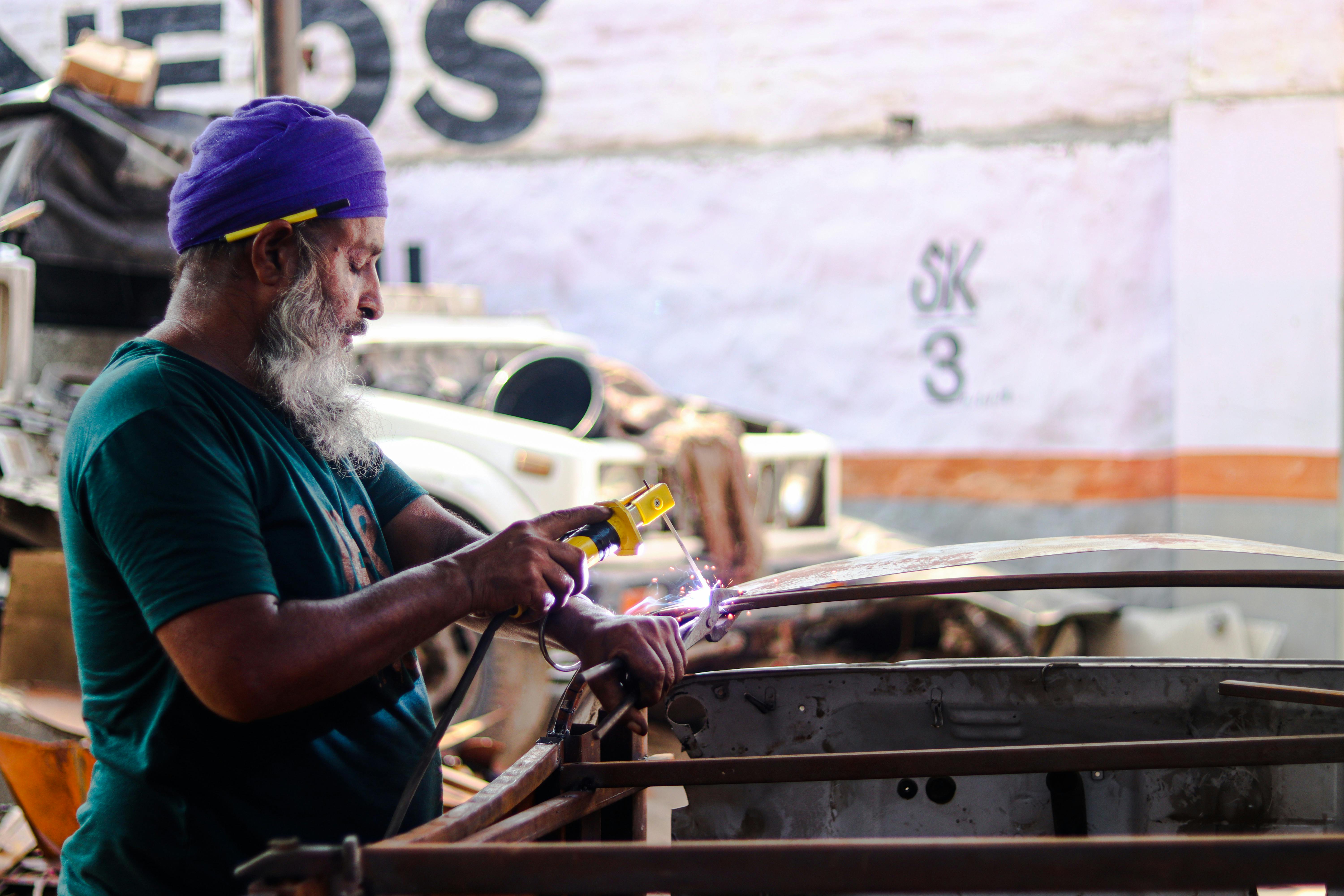 A Man Using Welding Machine · Free Stock Photo