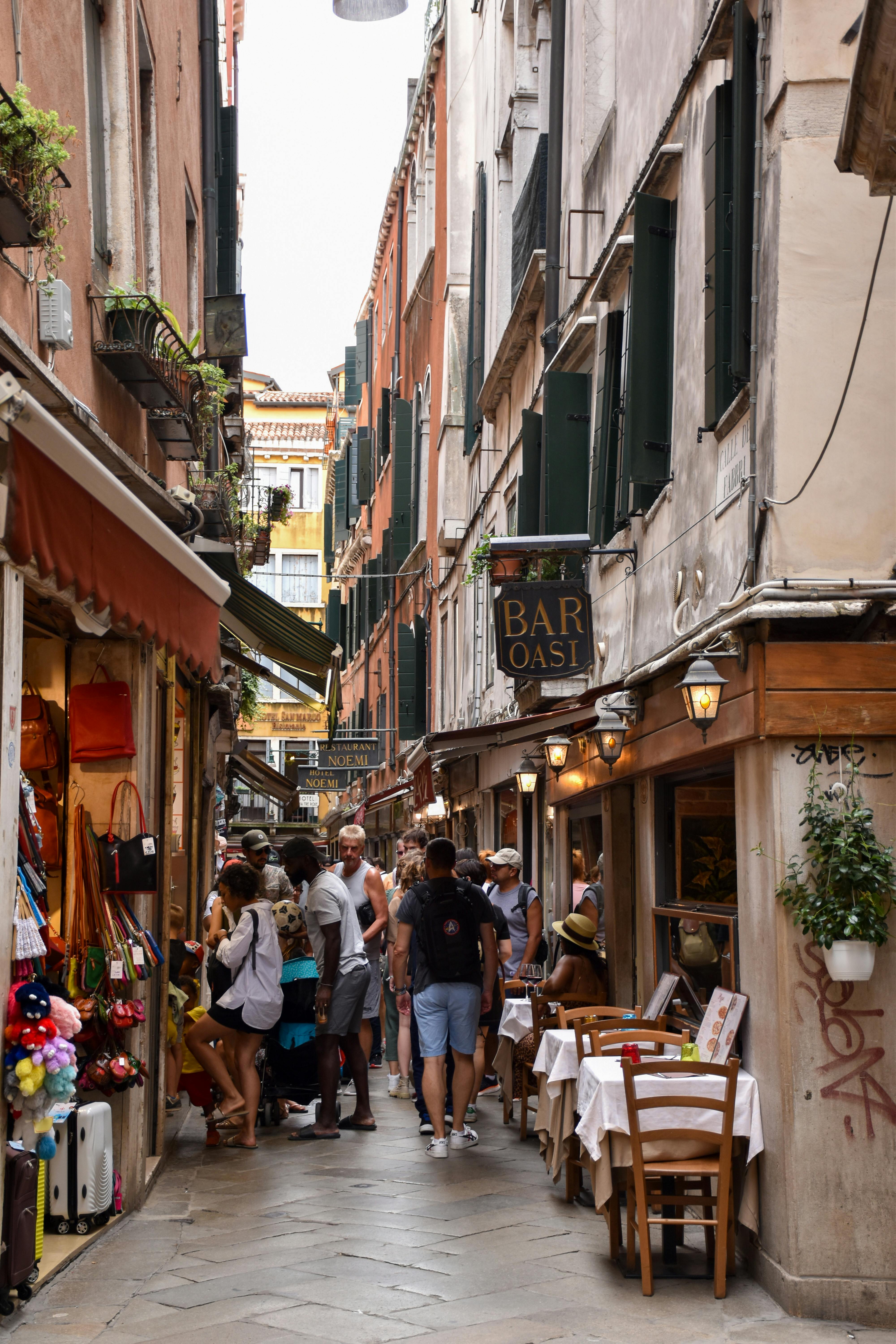 Low-Angle Shot of Alleyway and Houses under the Sky · Free Stock Photo