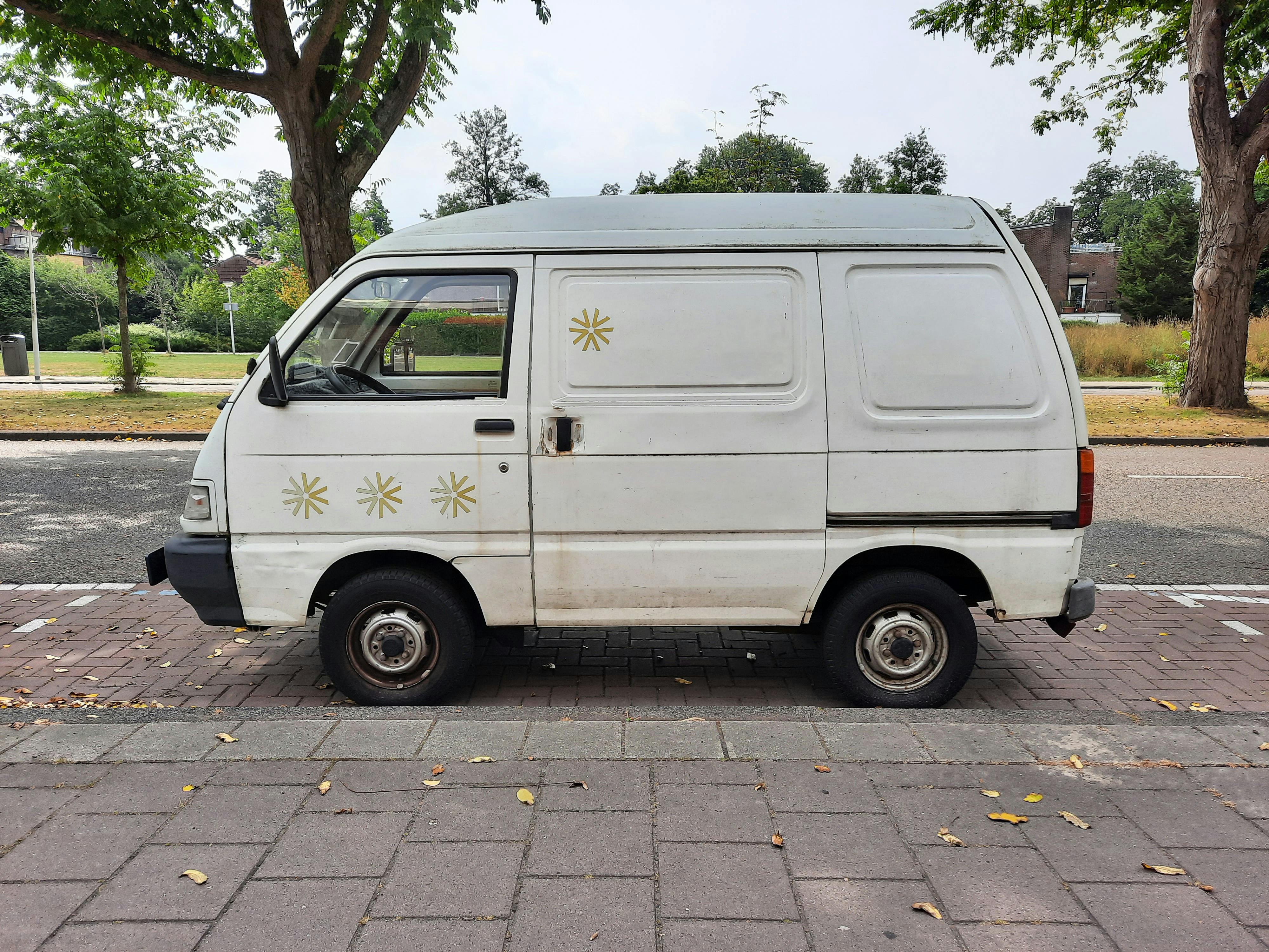 White Van Parked on the Street · Free Stock Photo