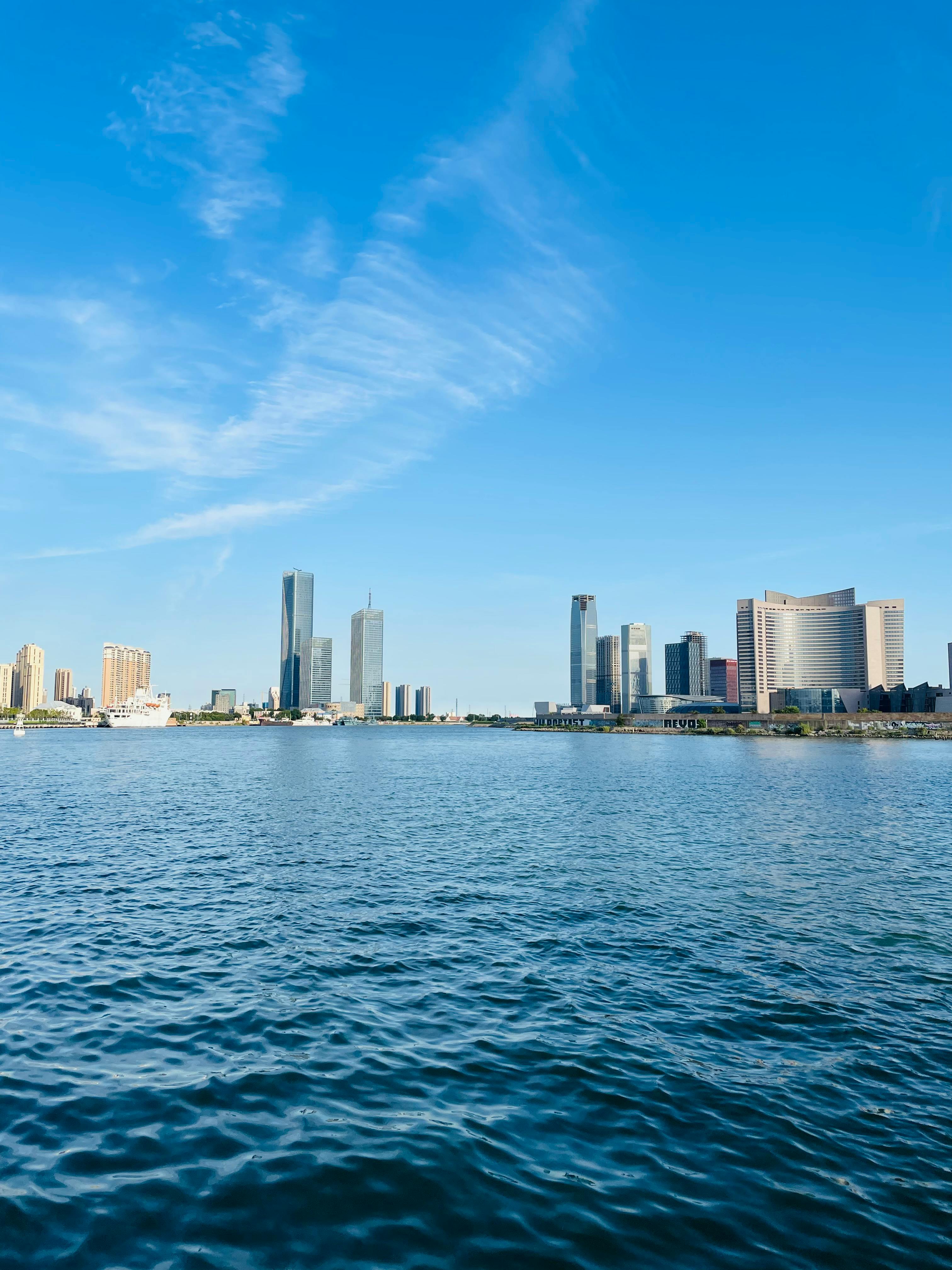 City Skyline Across Body of Water · Free Stock Photo