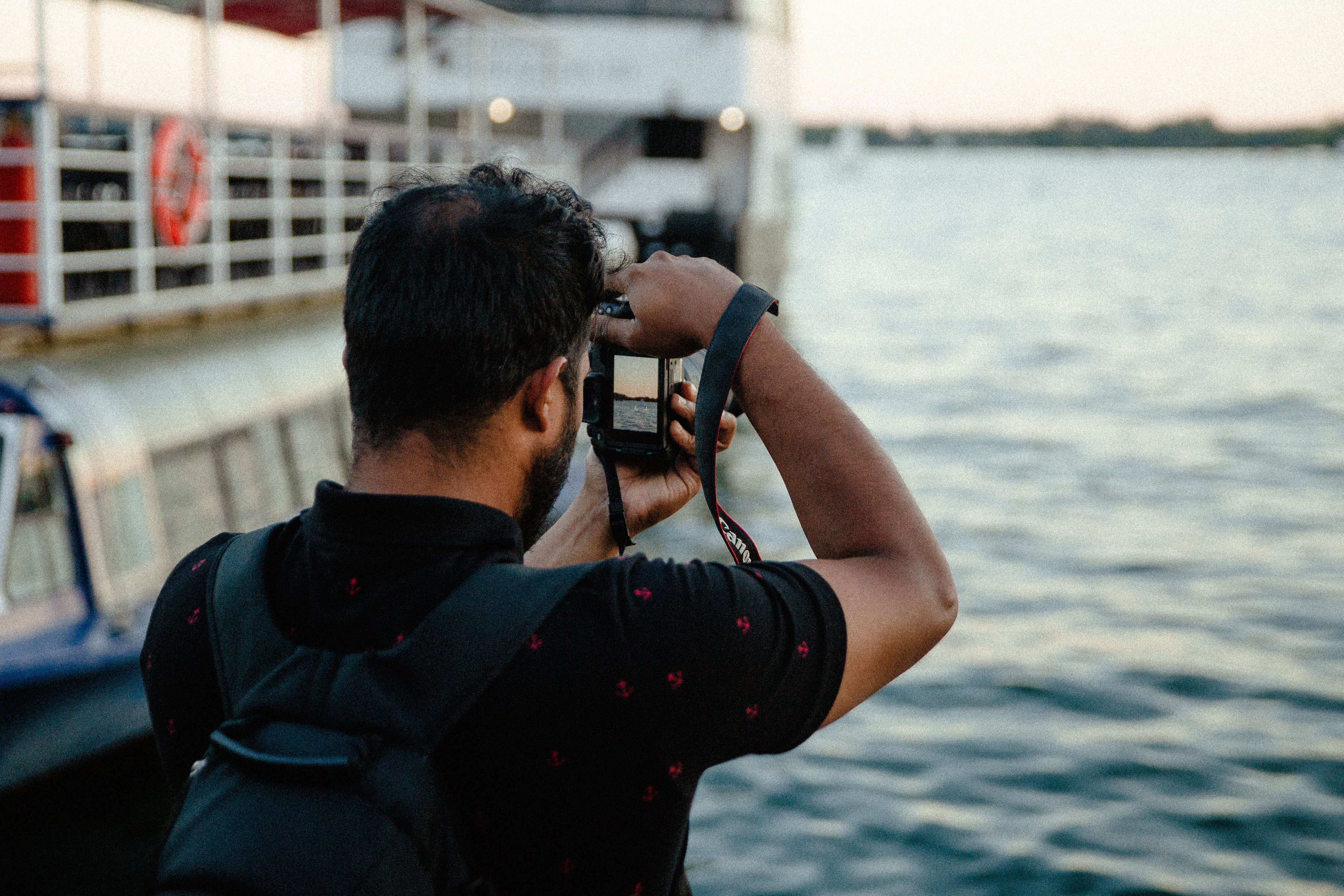 Man Photographing Sea · Free Stock Photo