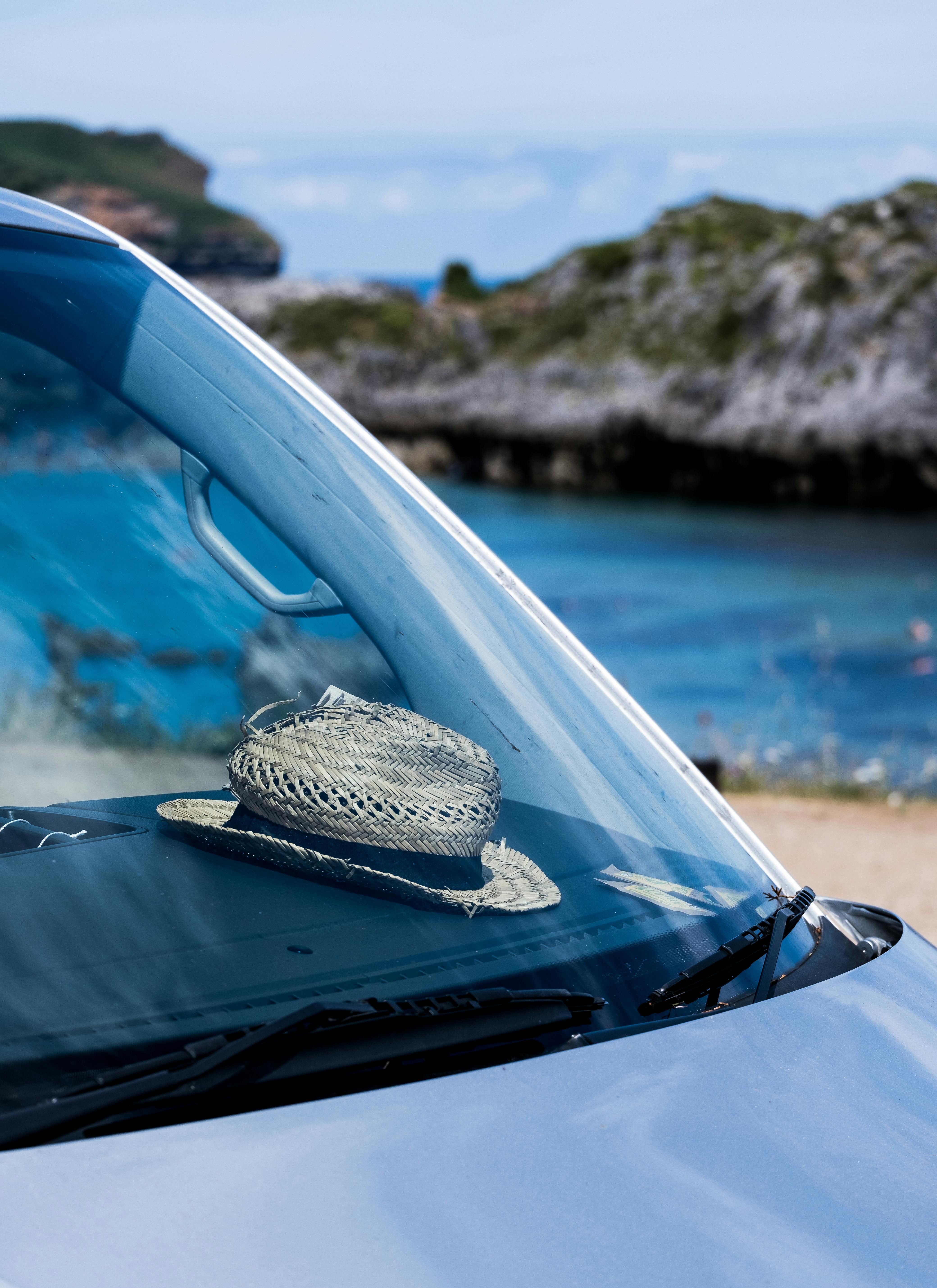 Hat on Windshield · Free Stock Photo