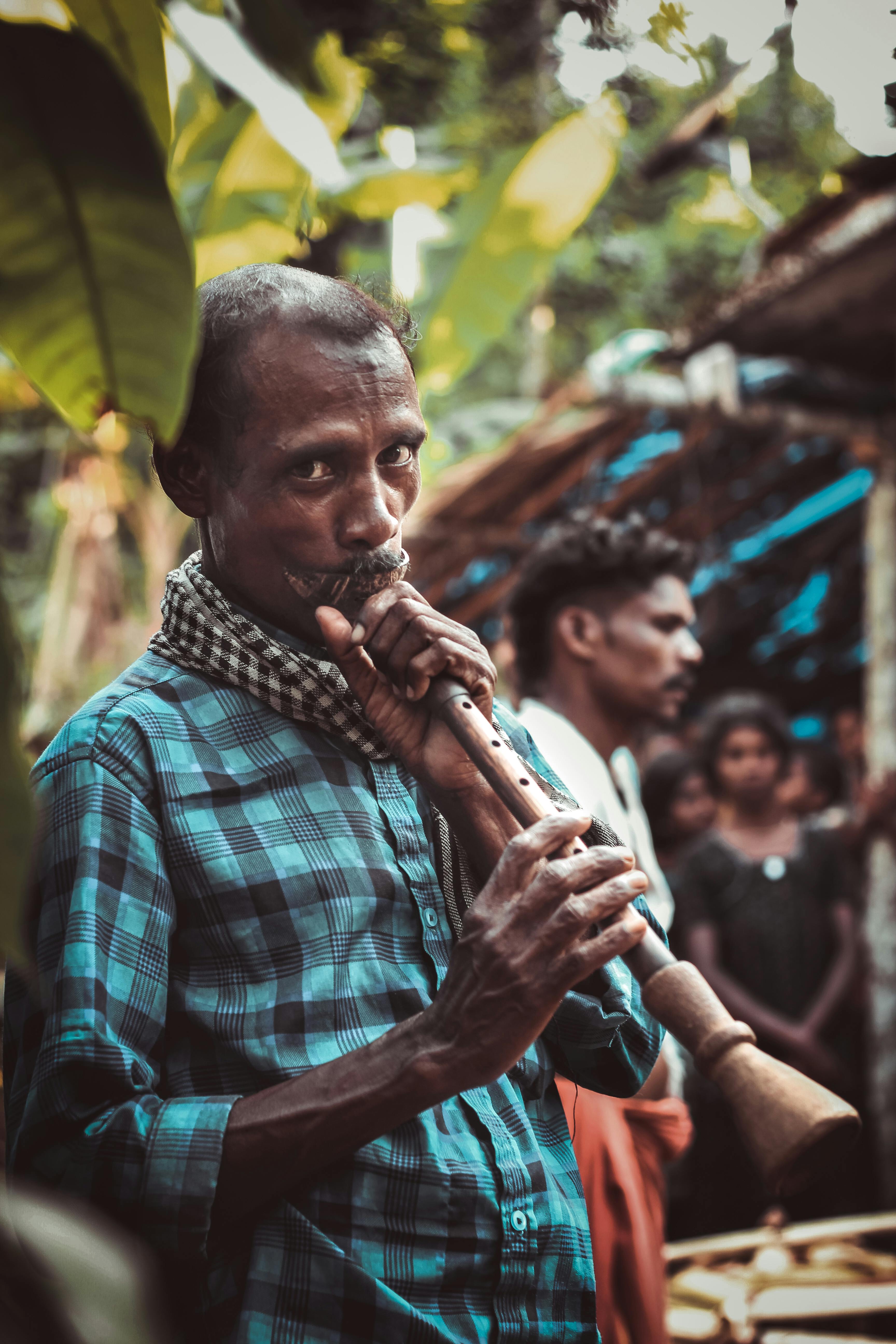 Man in Black Long Sleeves Playing Flute · Free Stock Photo