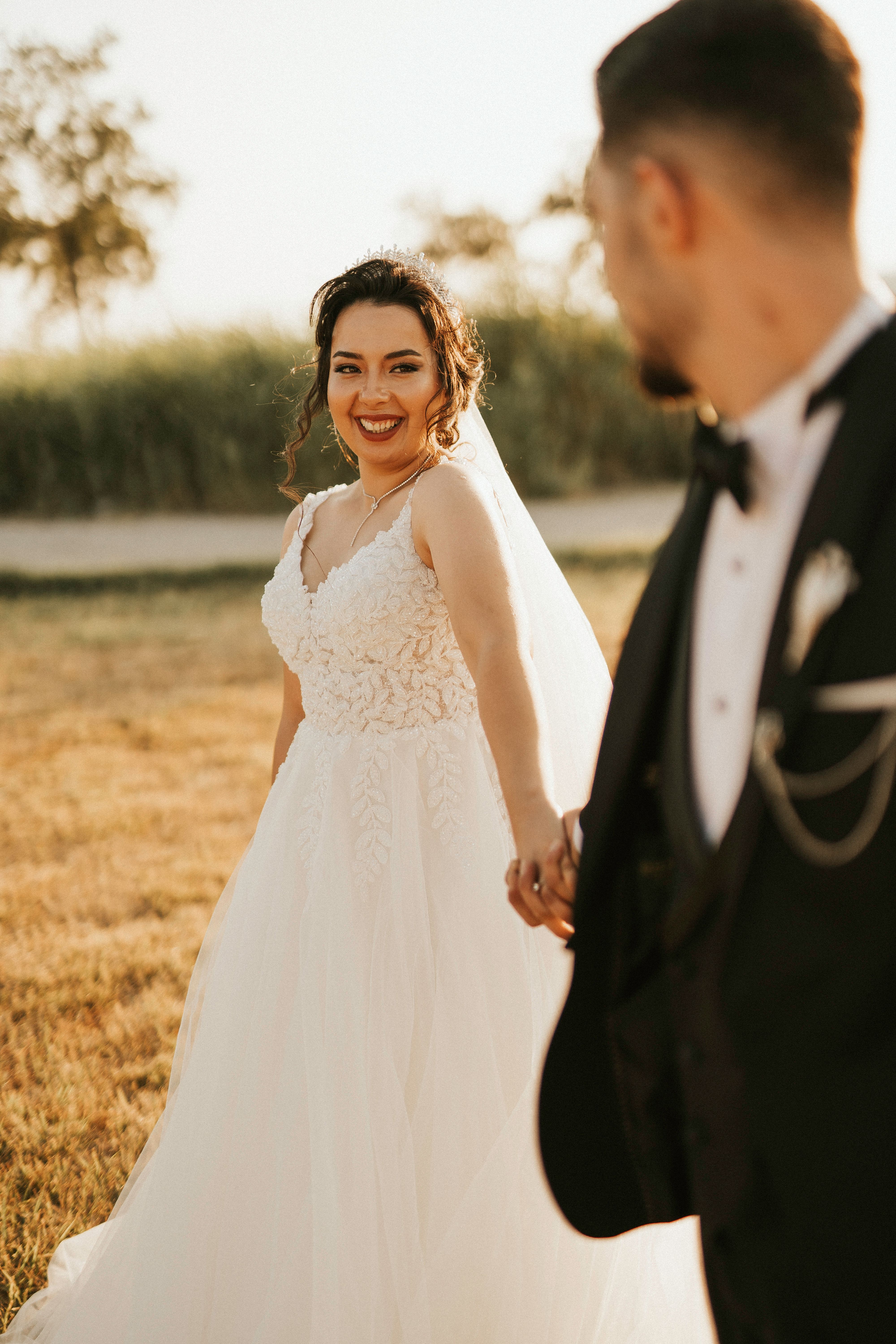 Bride and Groom Holding Hands · Free Stock Photo