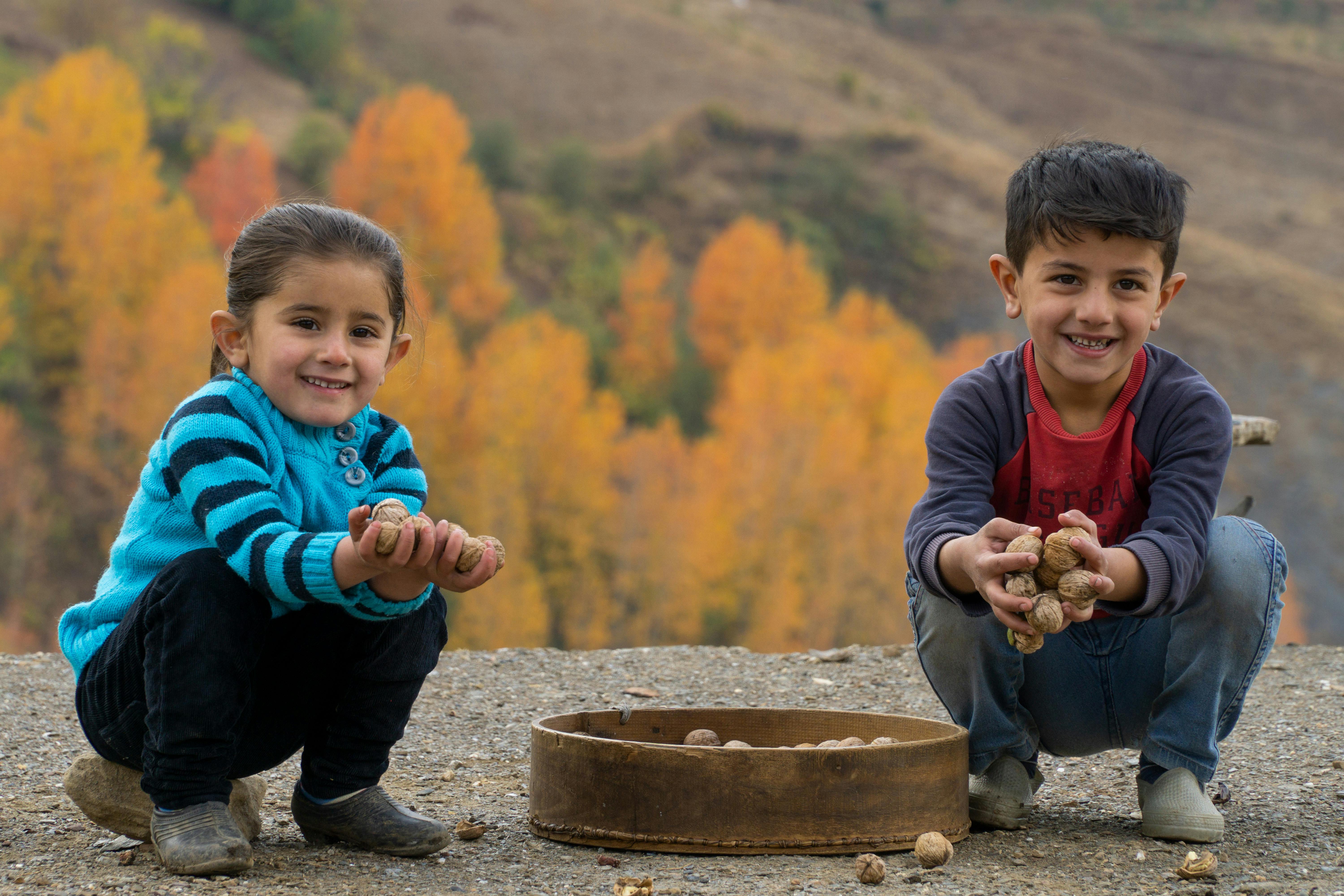 Kids with Walnuts · Free Stock Photo