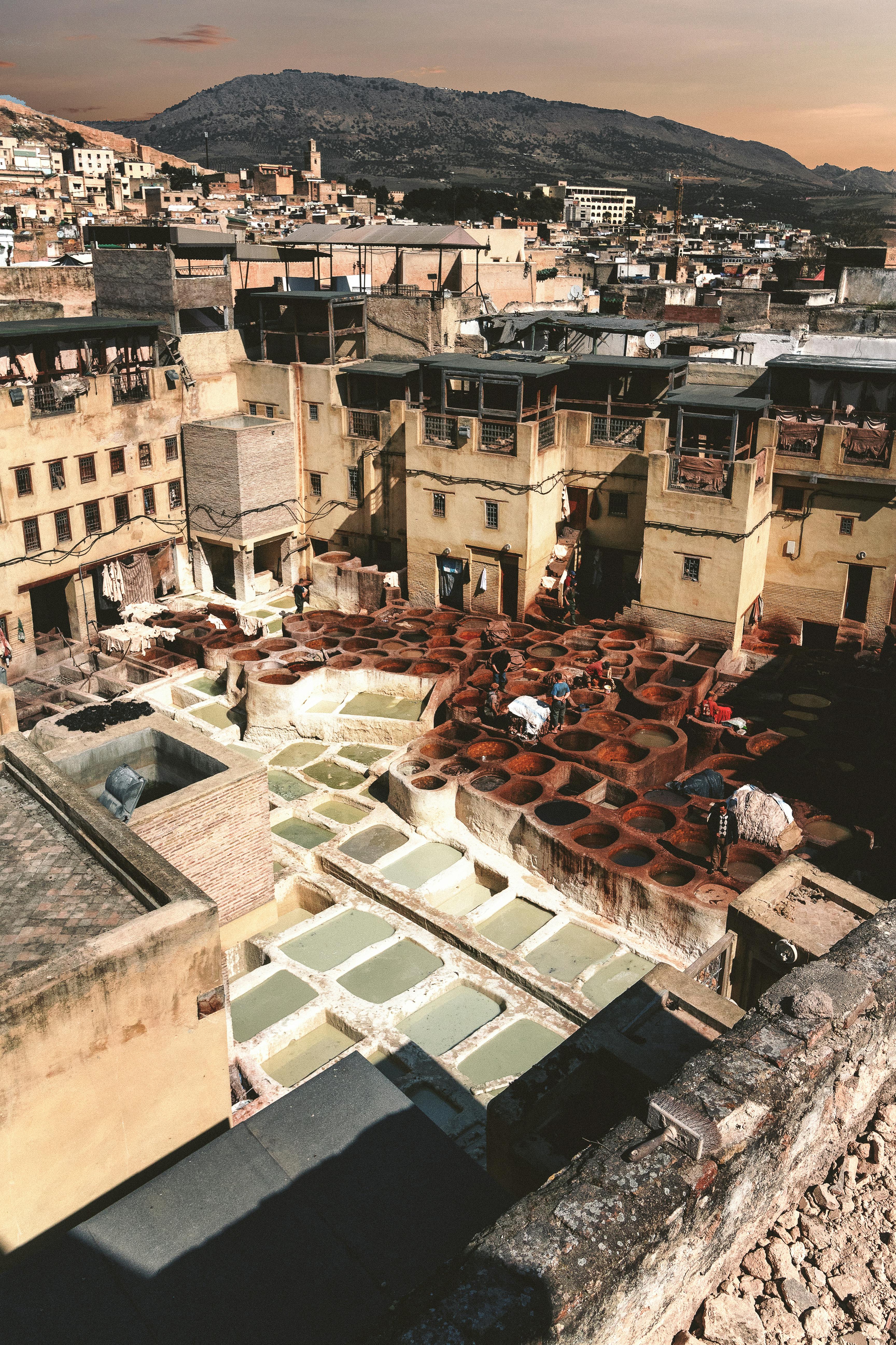Holes on Rooftop of Townhouse · Free Stock Photo