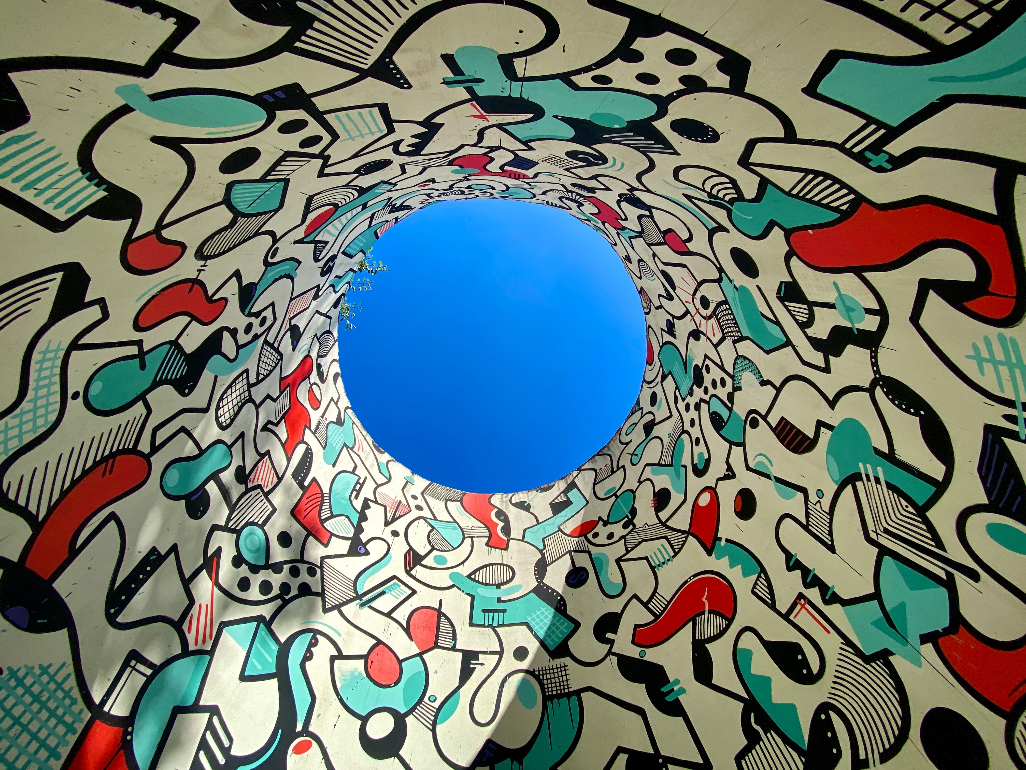 Blue Sky Seen from Graffiti Covered Construction · Free Stock Photo