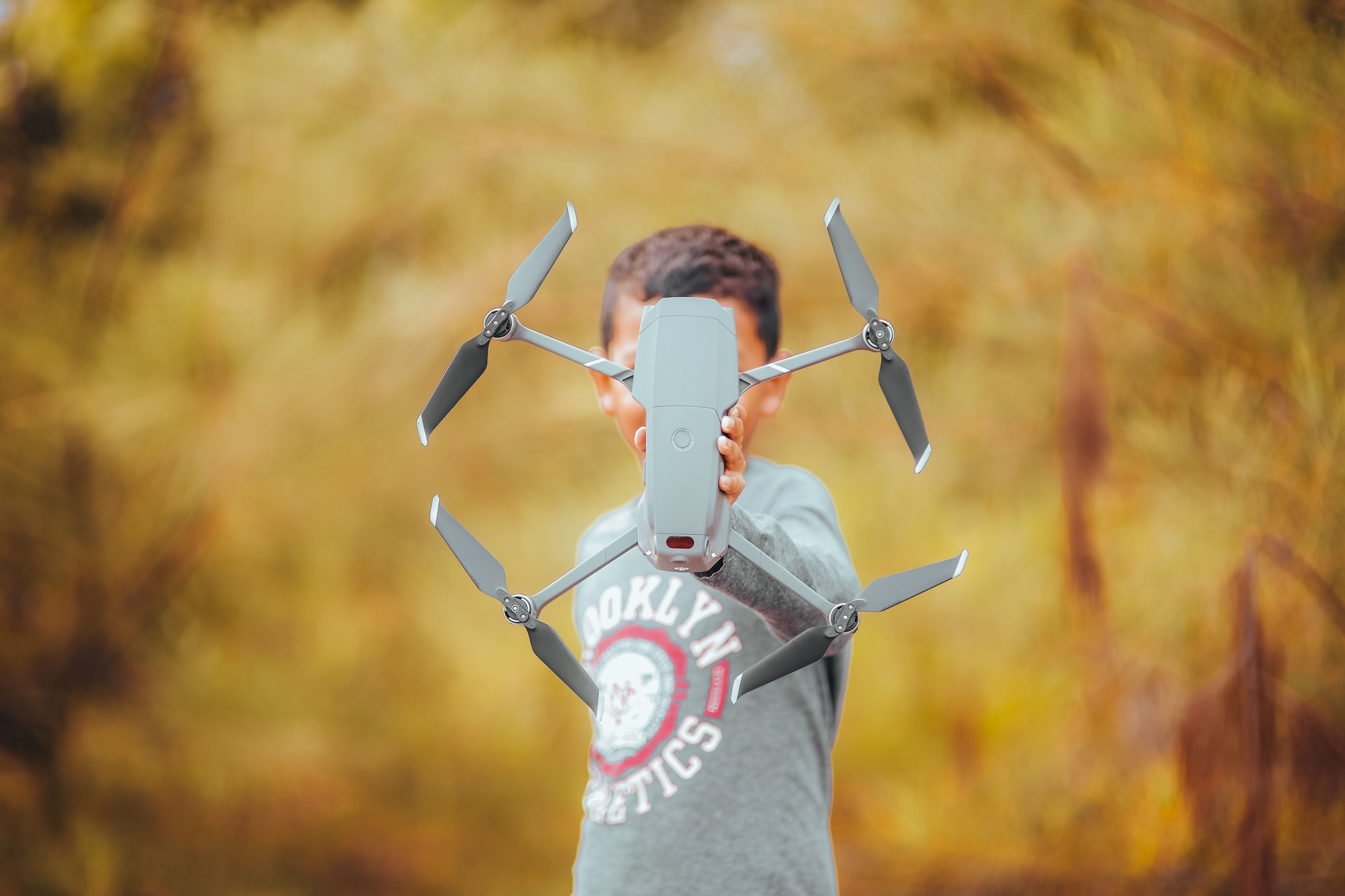 A Man Holding a Drone Camera · Free Stock Photo