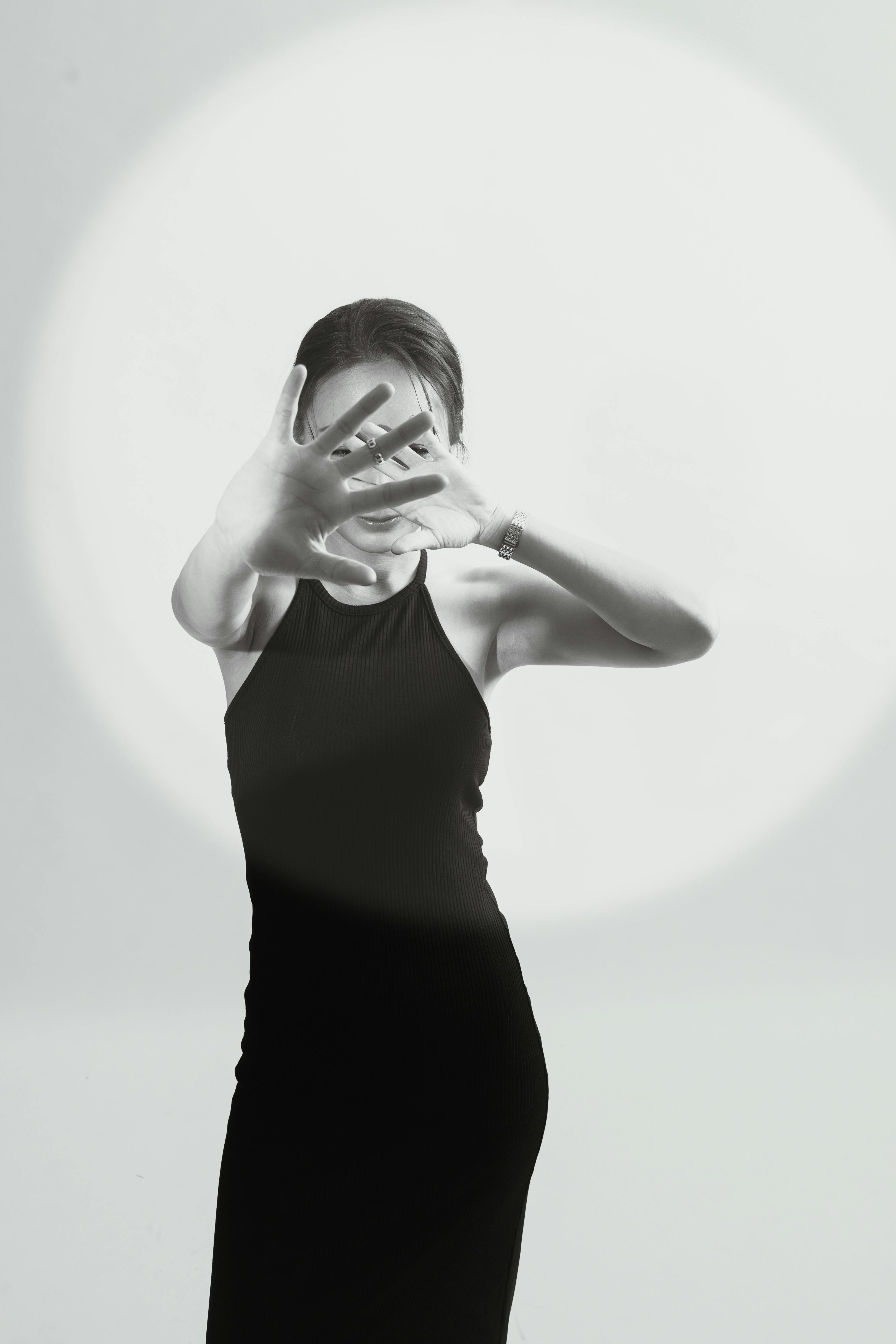 Grayscale Photo of a Woman in Black Dress · Free Stock Photo