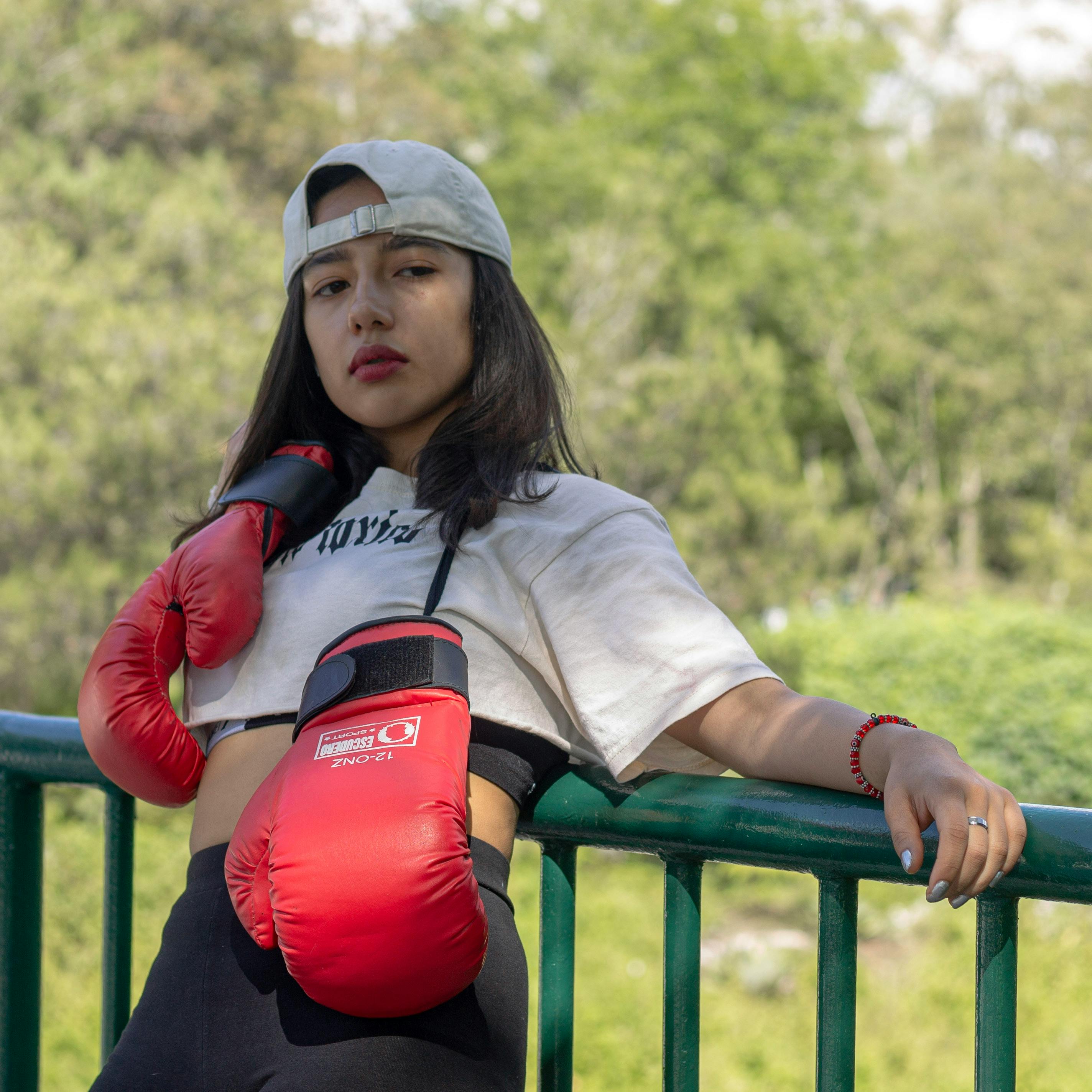 Boxing Gloves around a Woman's Neck · Free Stock Photo