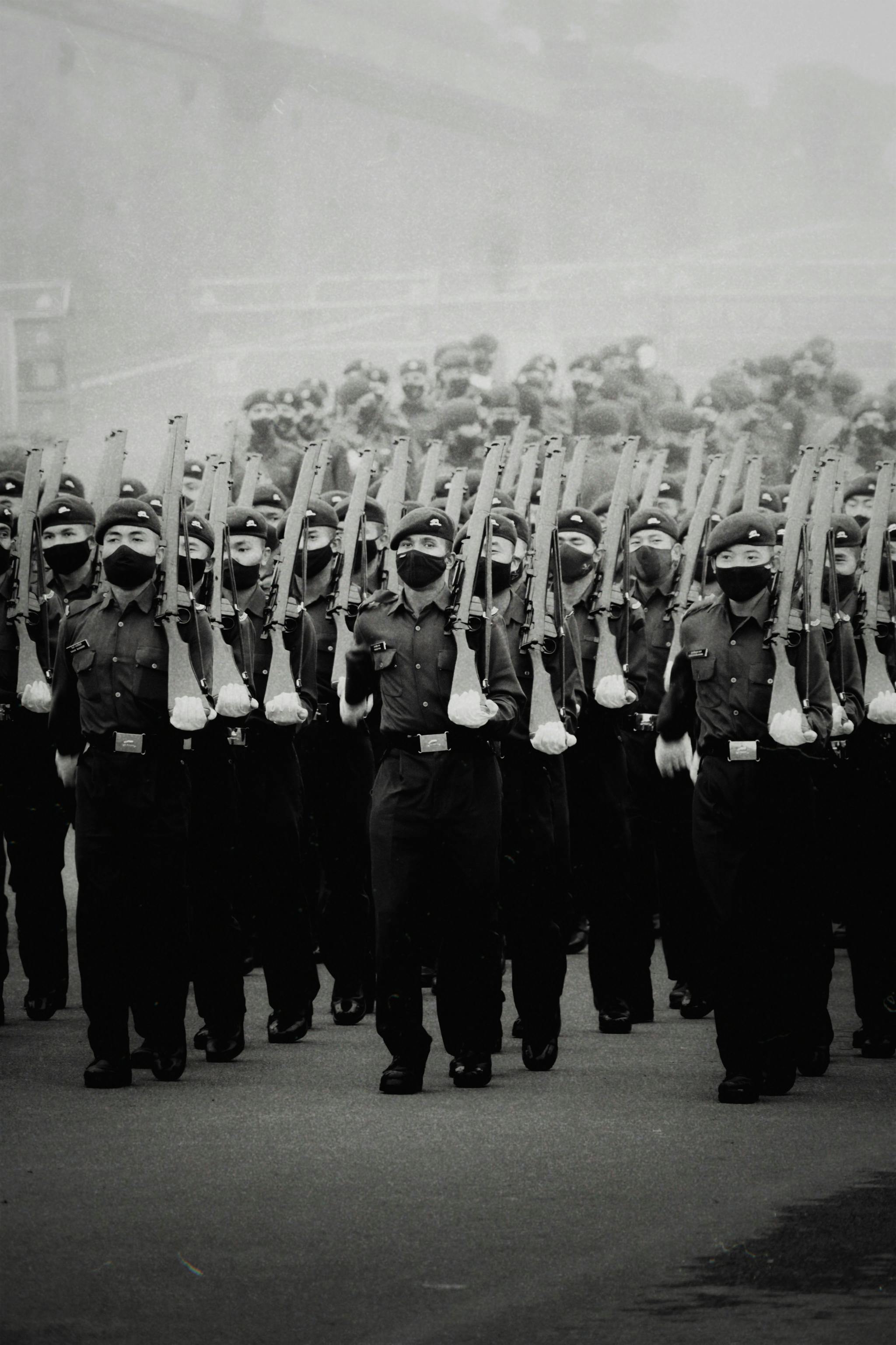 Grayscale Photo of Men in Uniform Marching on the Street Playing ...