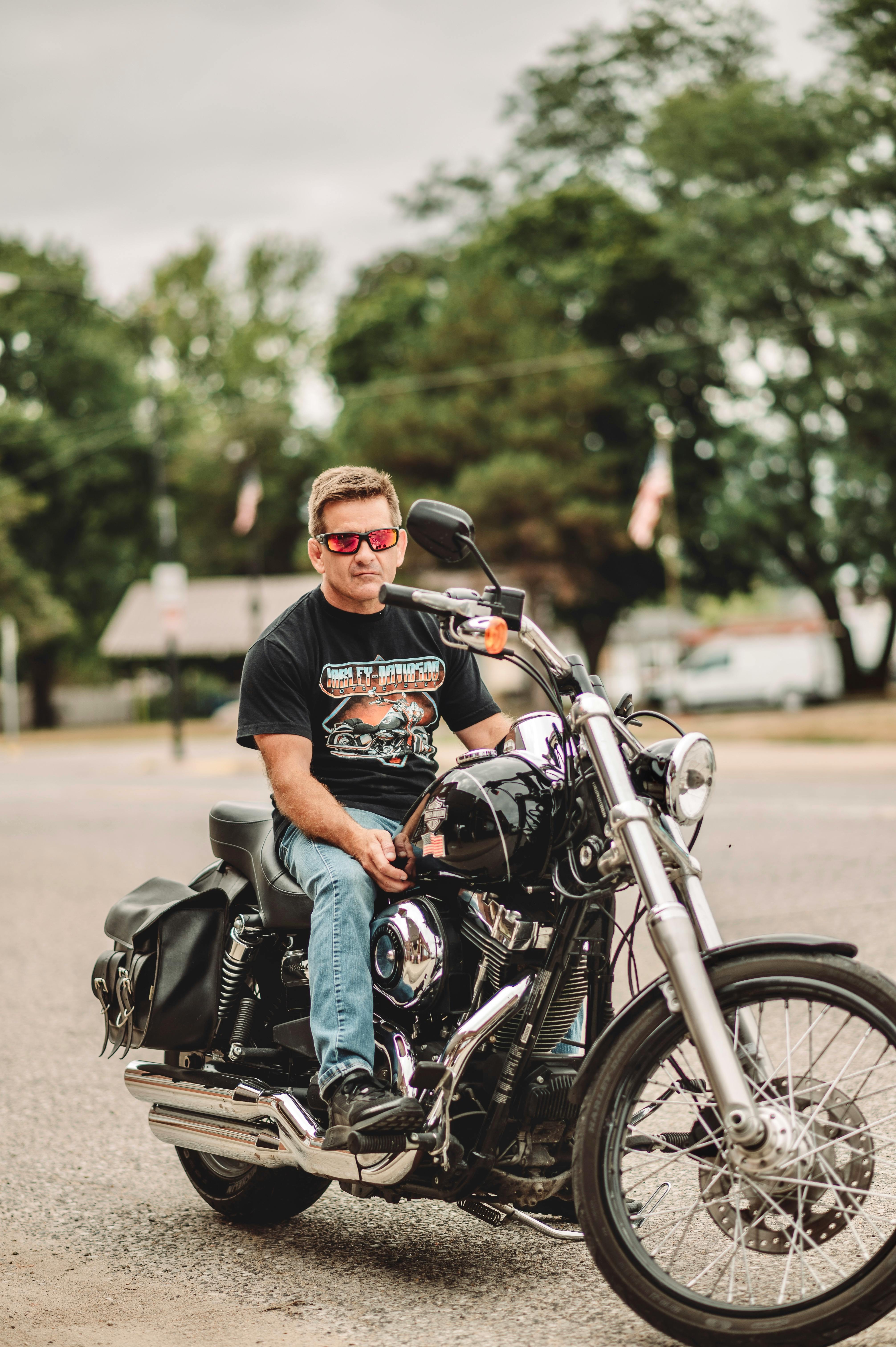 Man in Sunglasses Sitting on a Motorcycle · Free Stock Photo