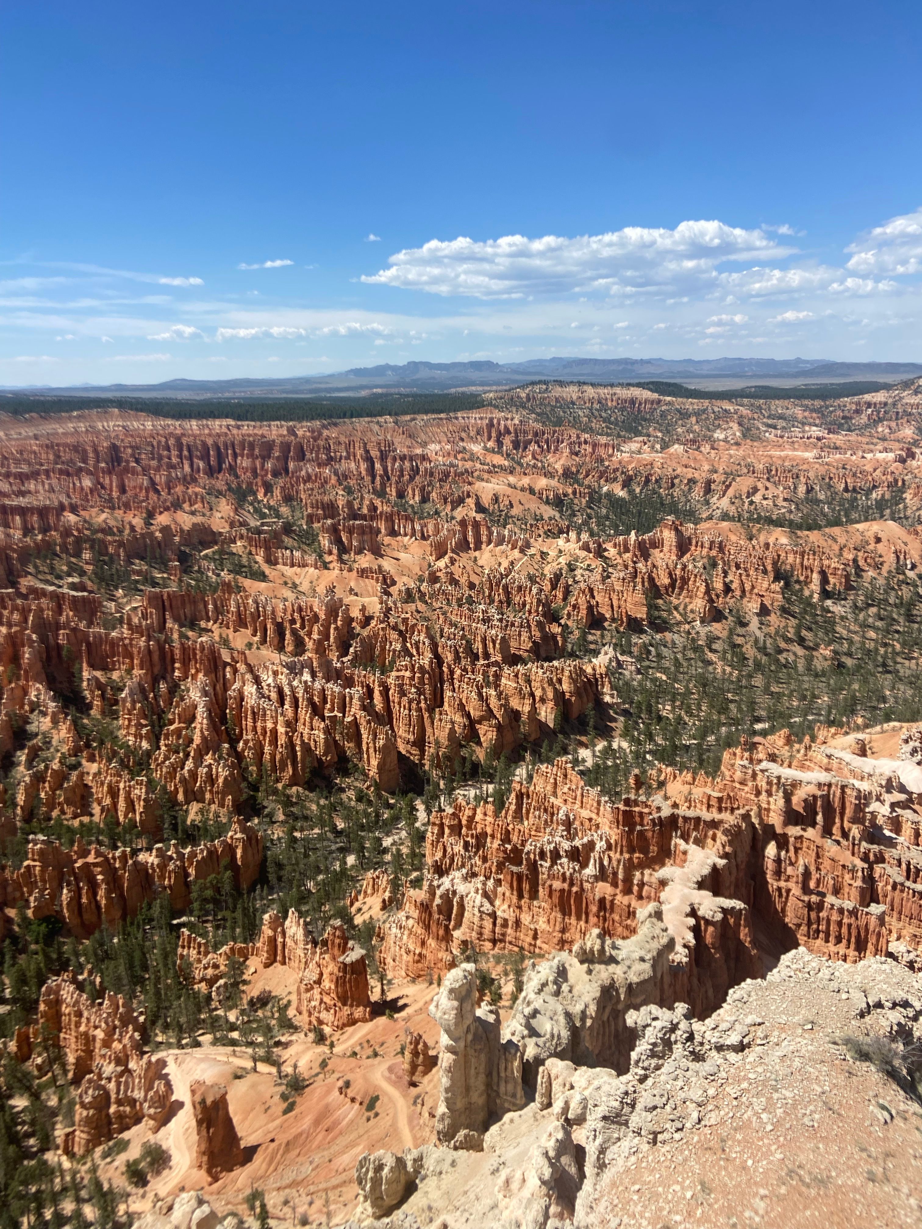 natural-rock-formations-under-a-blue-sky-with-white-clouds-free-stock