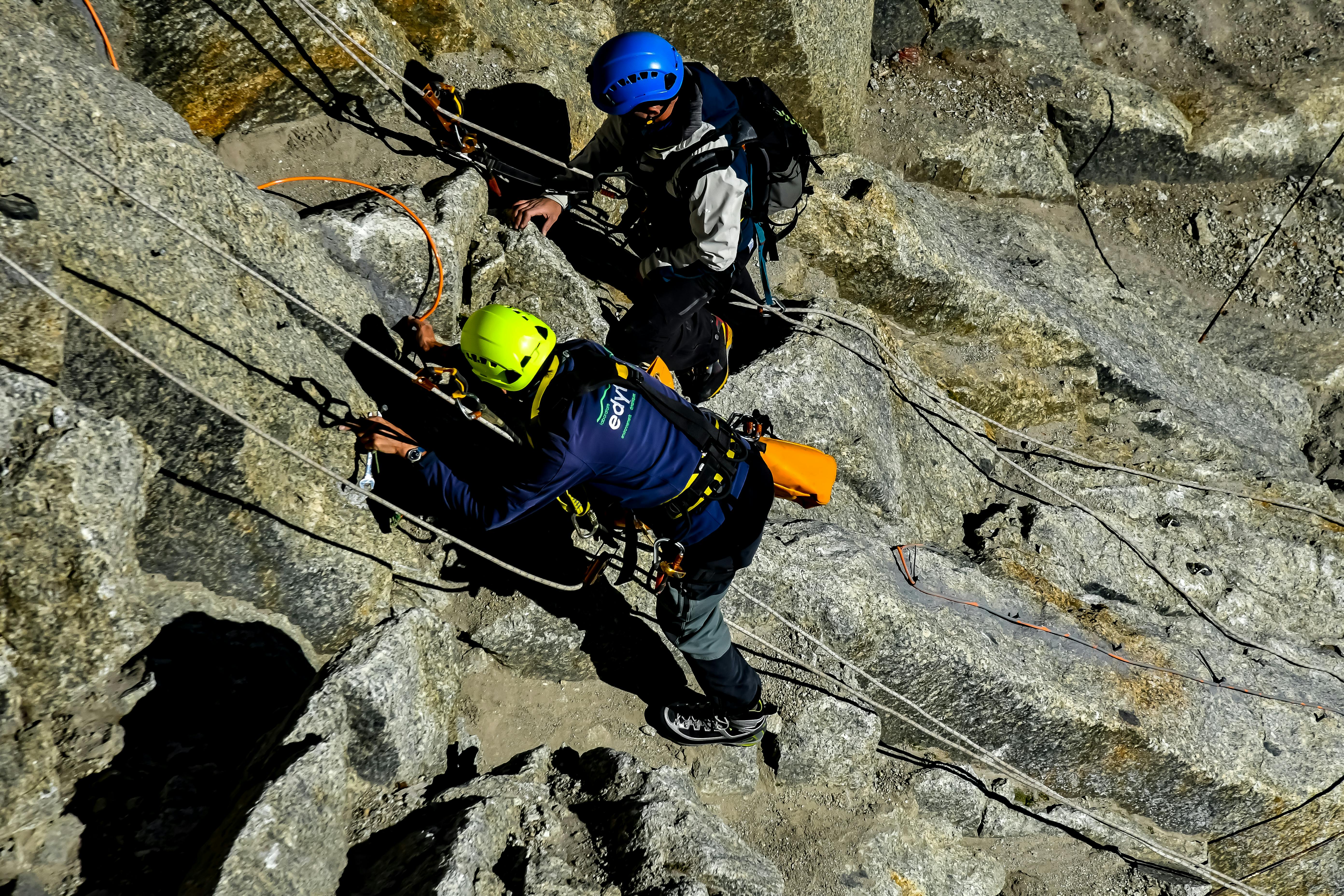 Photo of Two People Climbing a Mountain · Free Stock Photo