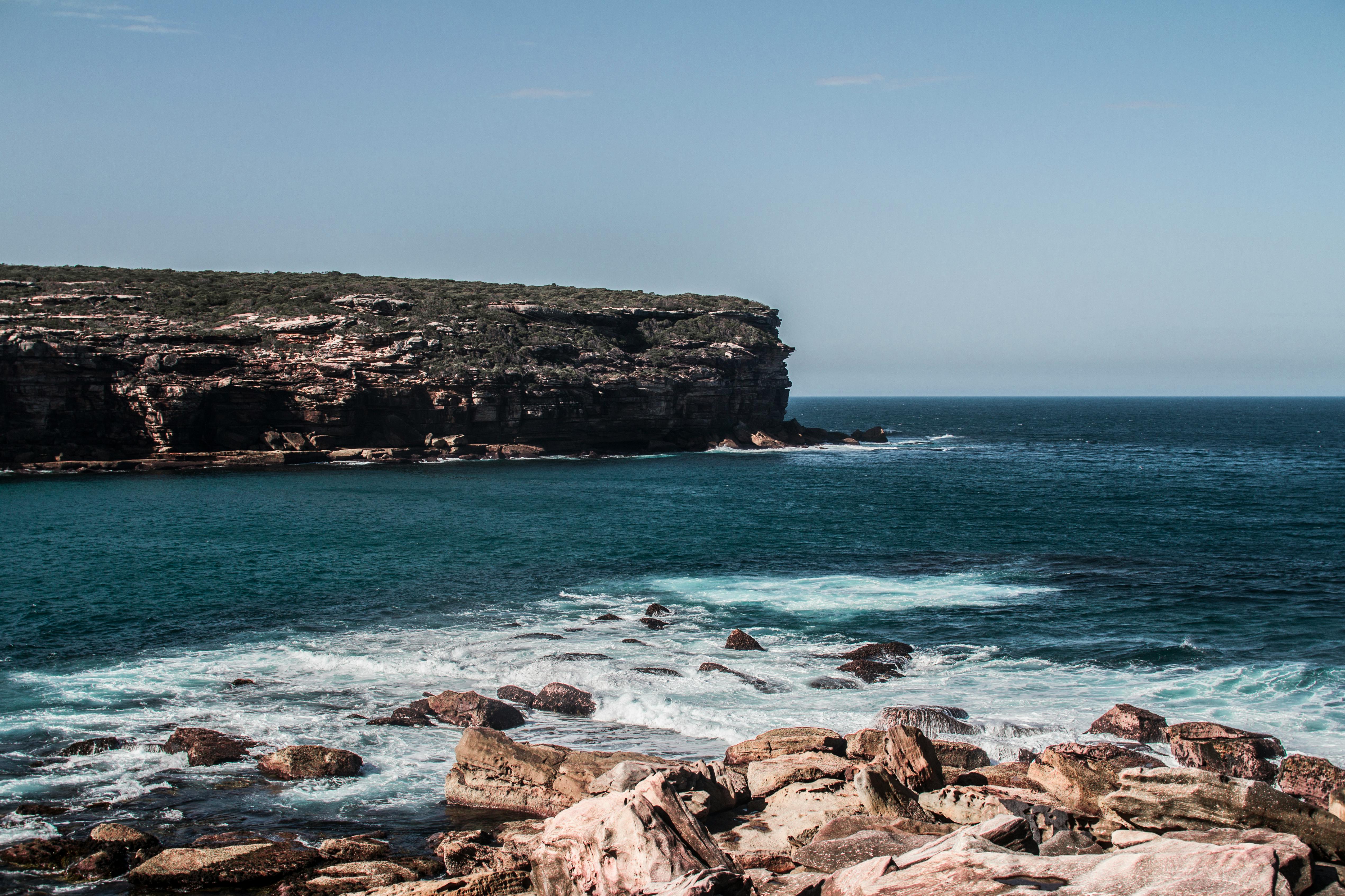 Photograph of Rocks Near an Ocean · Free Stock Photo