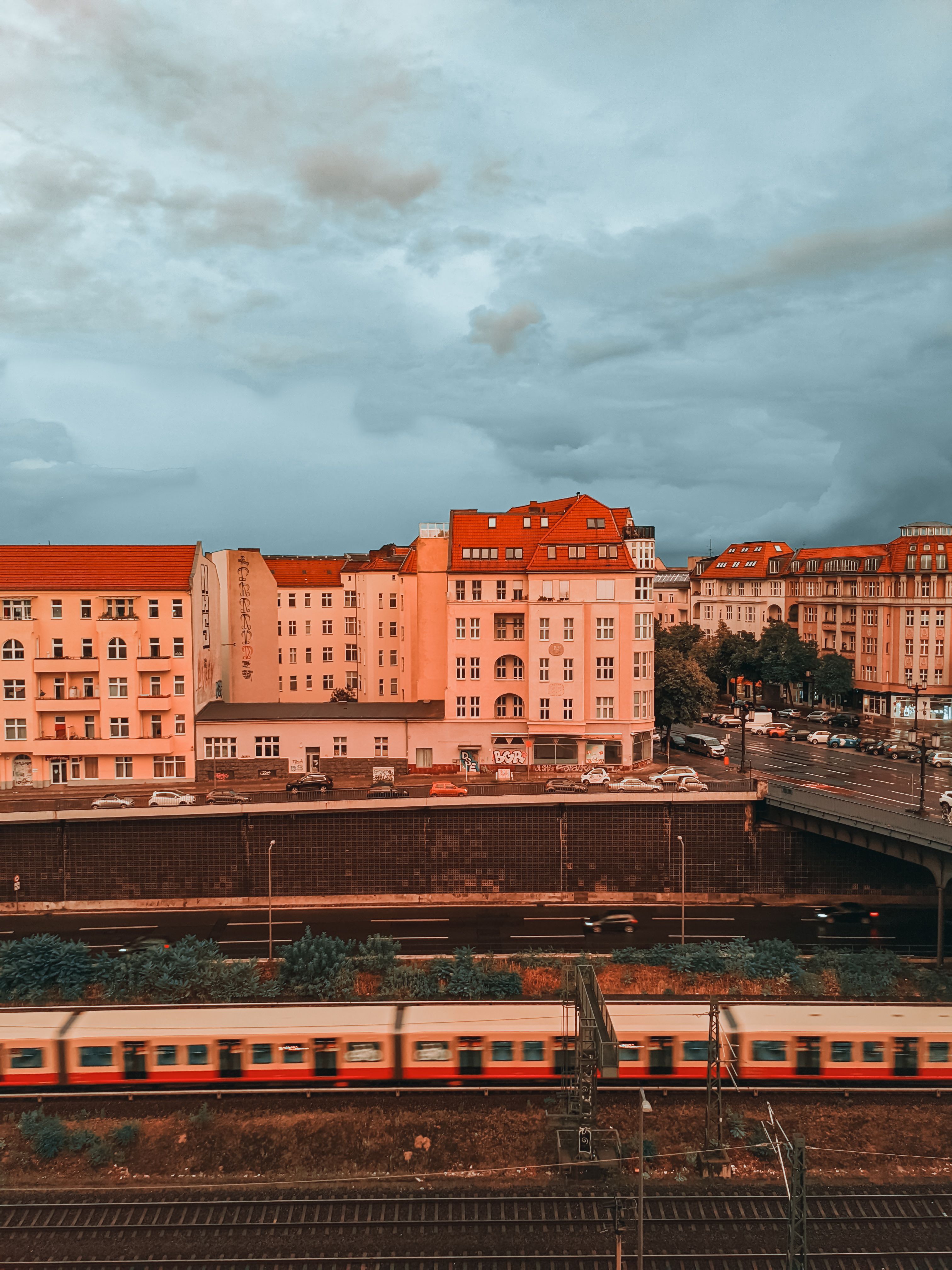 Cityscape with a Moving Train and Tracks · Free Stock Photo