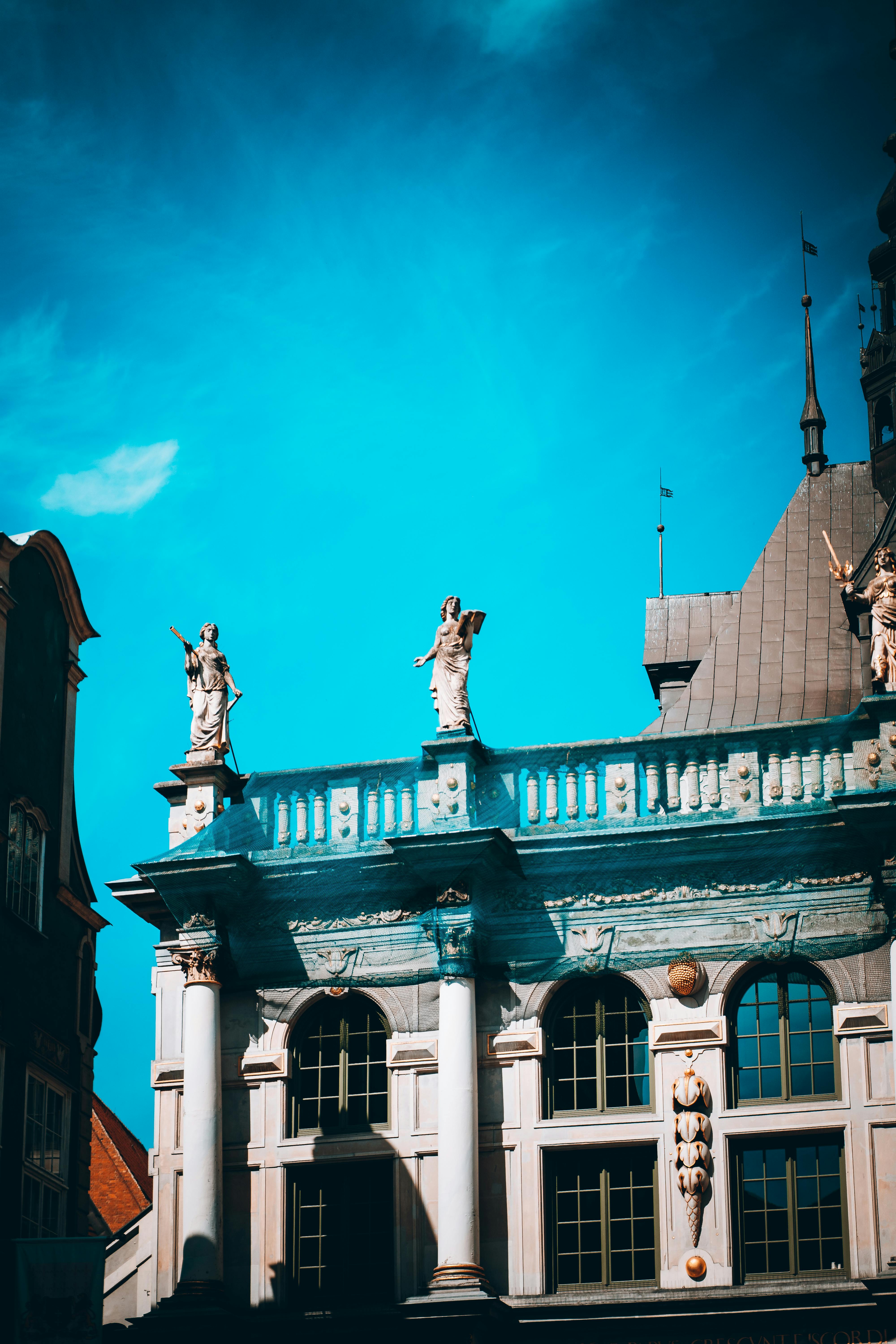 Statues of Angels on a Concrete Building · Free Stock Photo