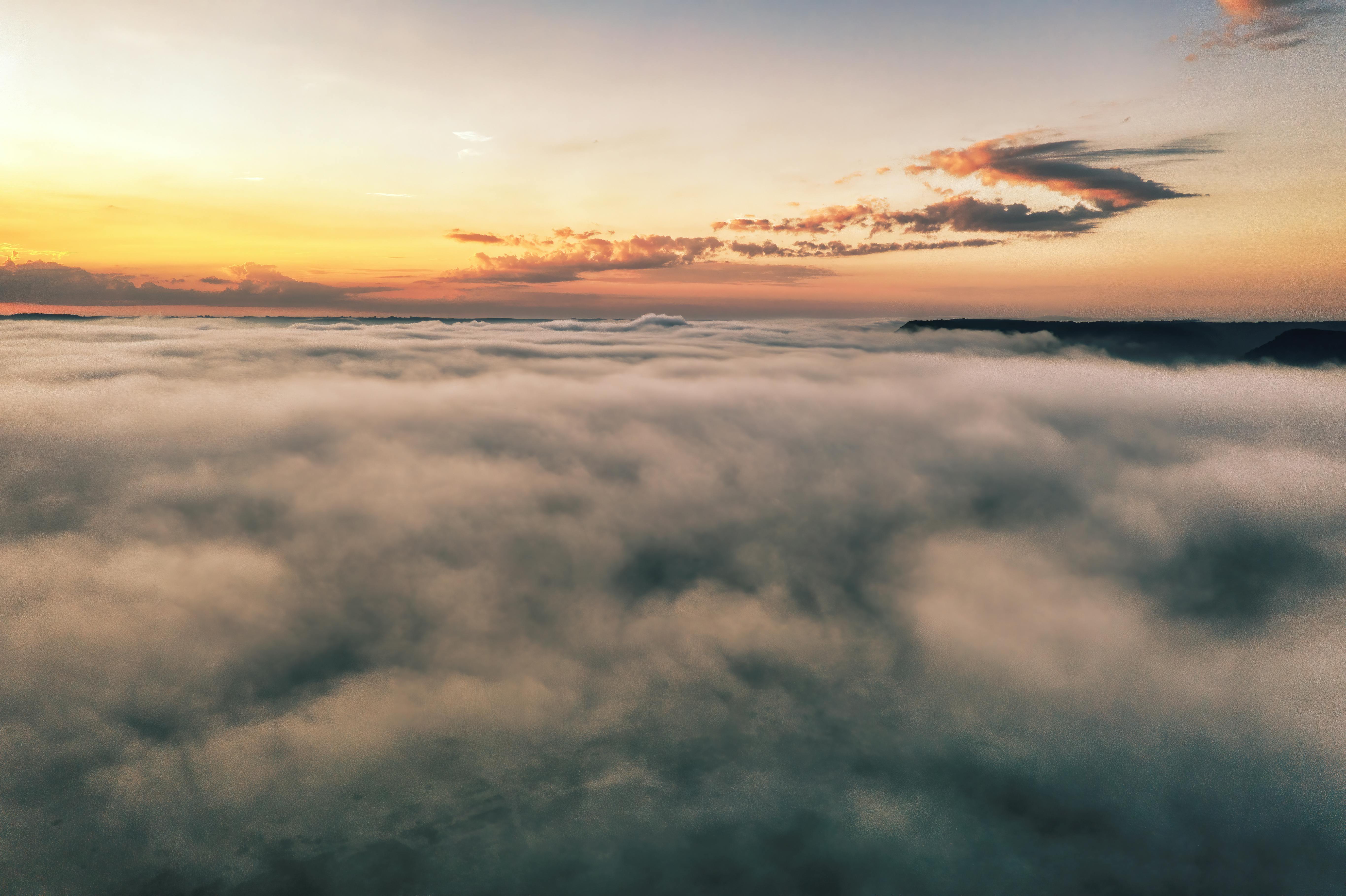 Sunset Sky over Low Lying Clouds · Free Stock Photo