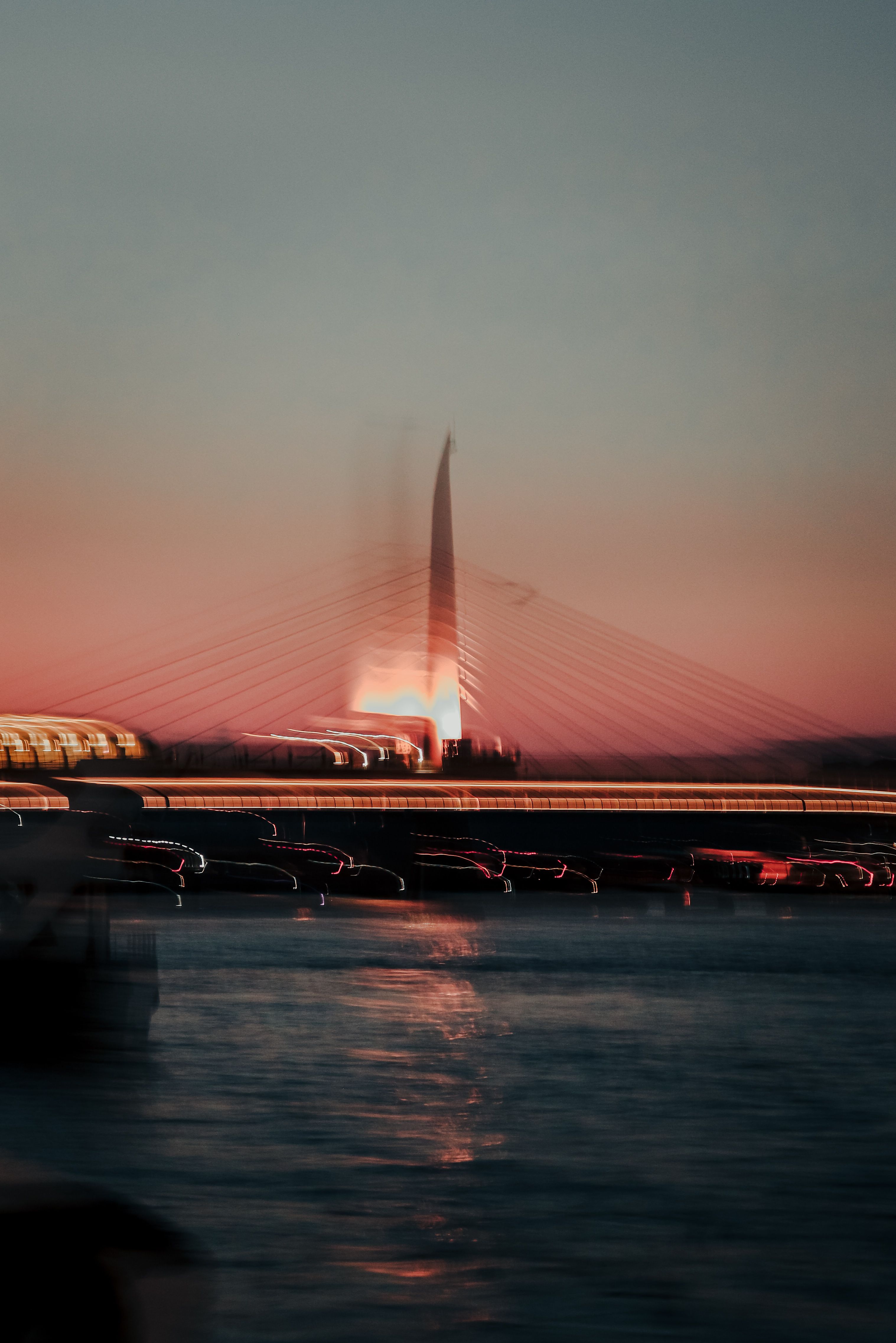 Blurred Shot of Bridge over the River during Night Time · Free Stock Photo