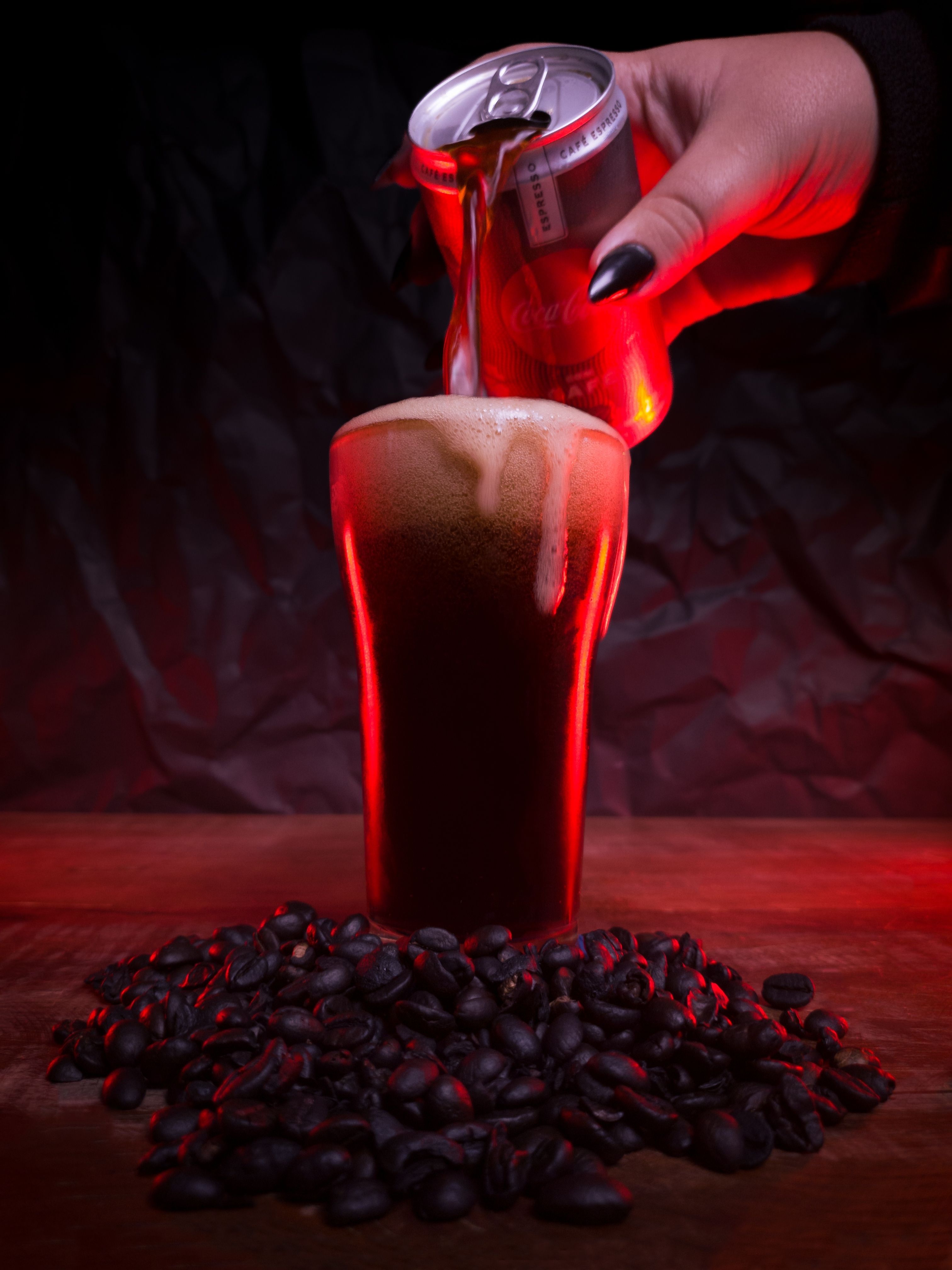 Woman Hand Holding Coca Cola Can over Glass near Coffee Beans · Free ...