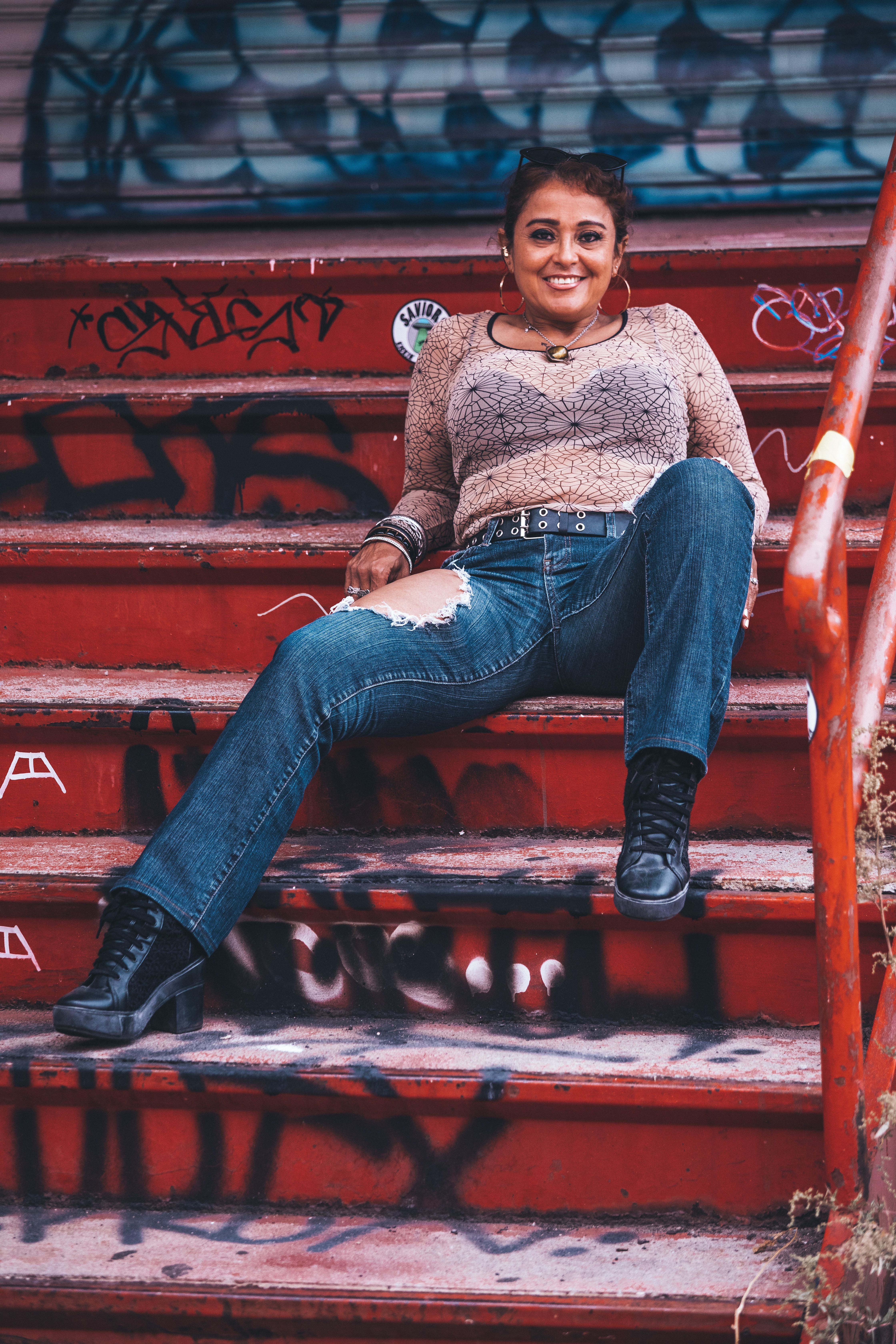 A Woman in Black Top and Denim Jeans Crying · Free Stock Photo
