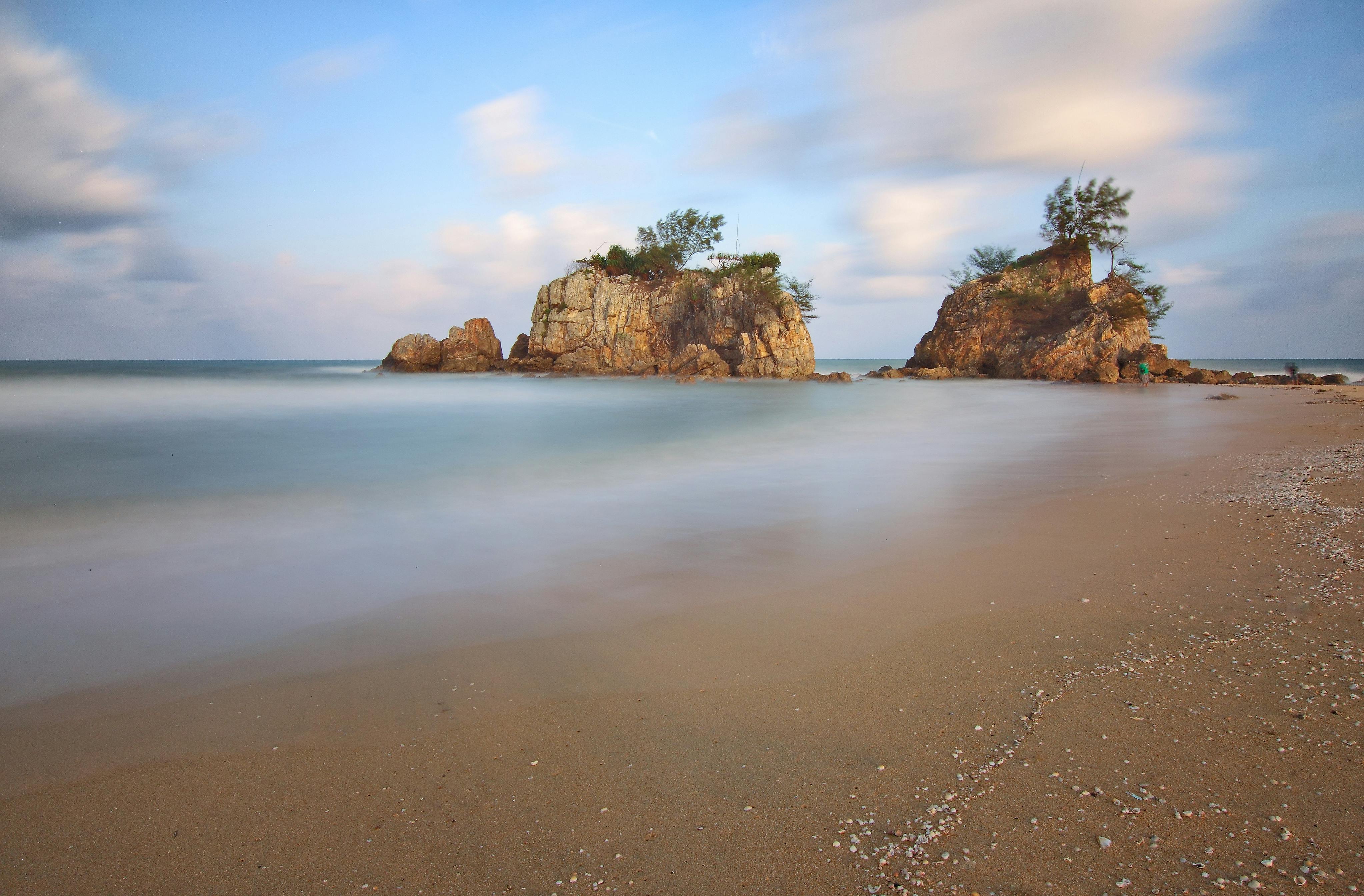 Landscape Photography of Two Rock Formations on Body of Water · Free ...