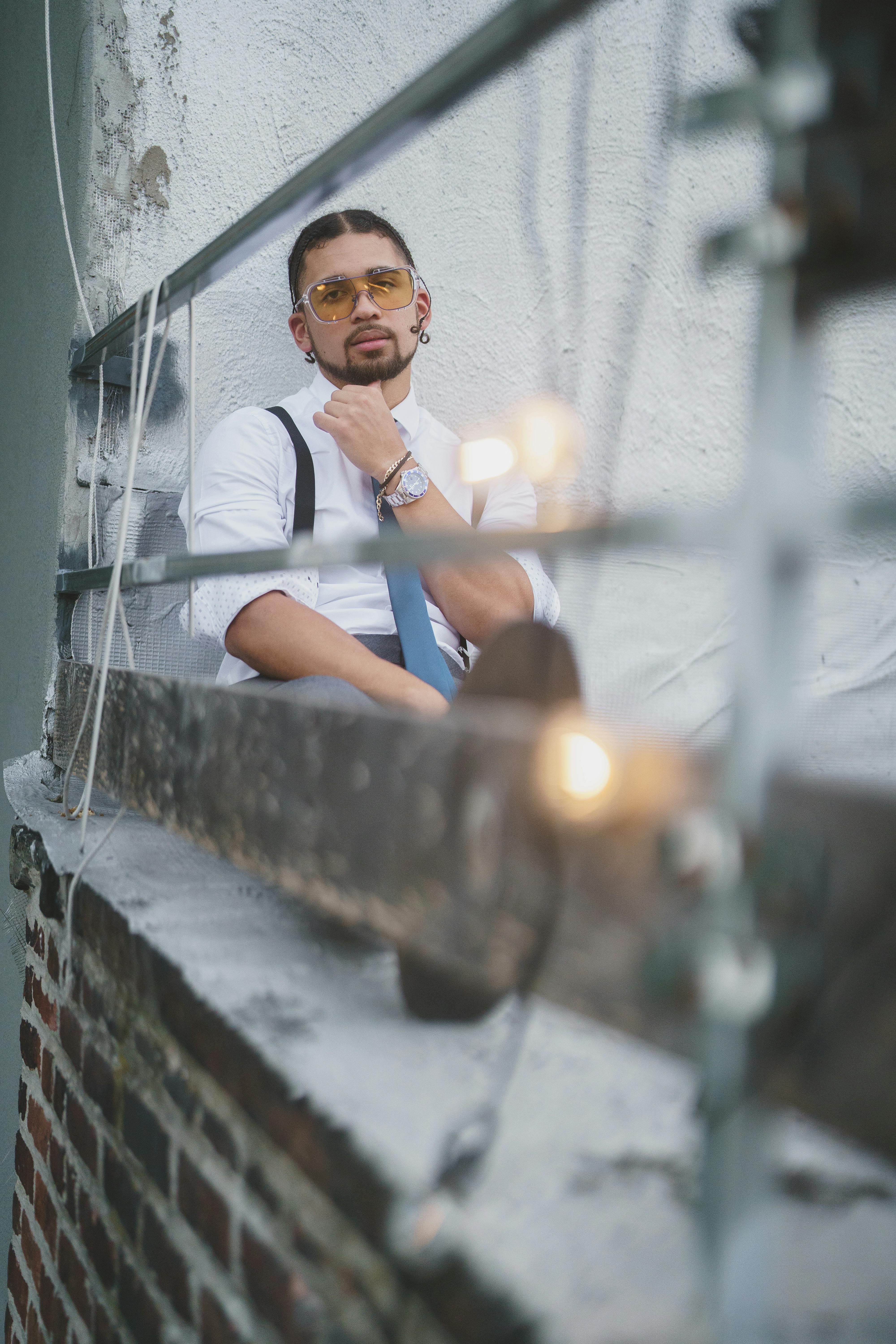 Man Sitting in Corner by Wall · Free Stock Photo