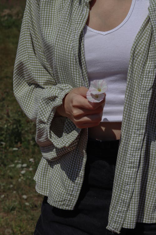 Woman Holding White Flowers · Free Stock Photo Woman Holding White Flowers · Free Stock Photo