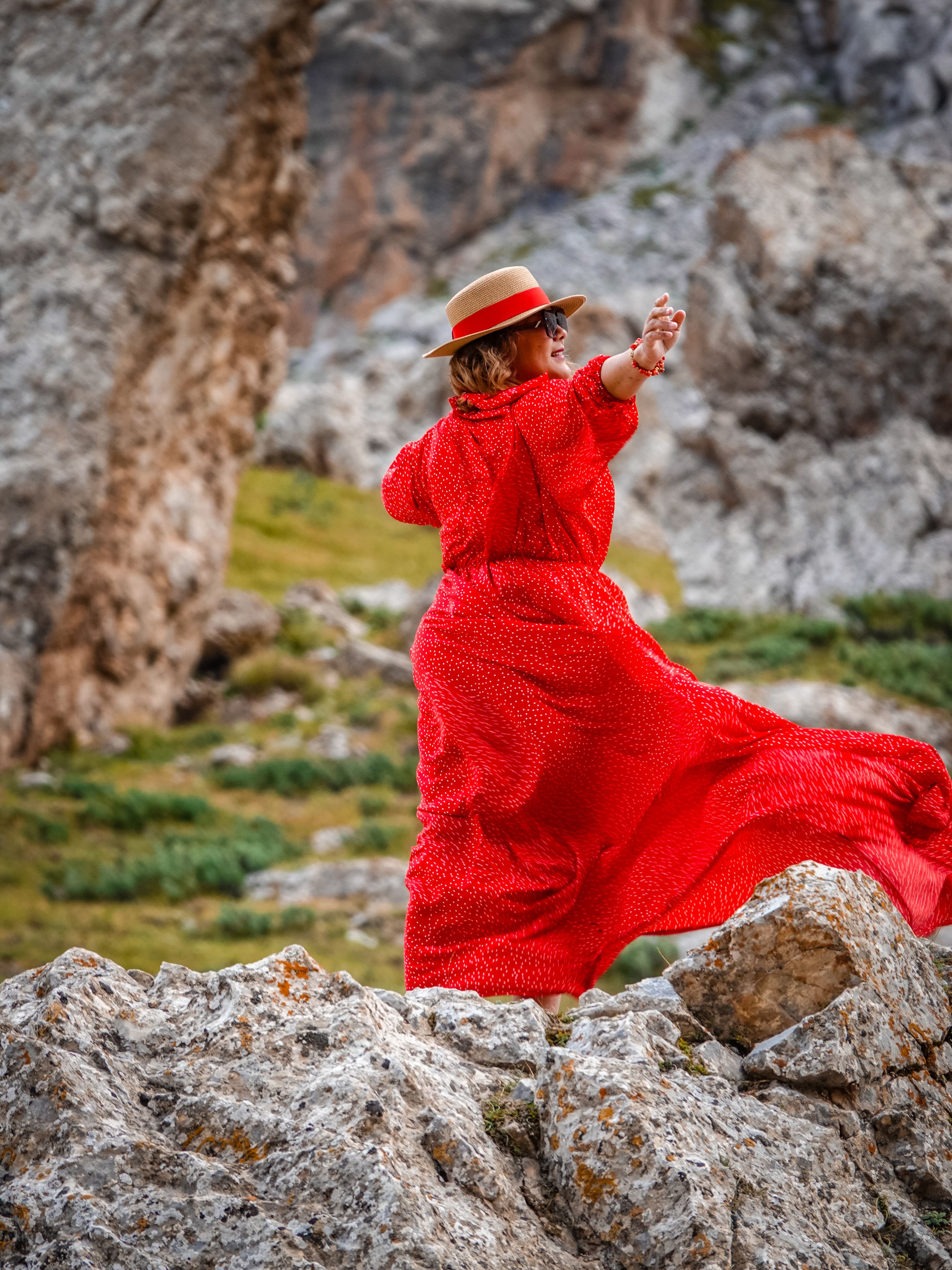 Woman in Hat on Rock near Water · Free Stock Photo