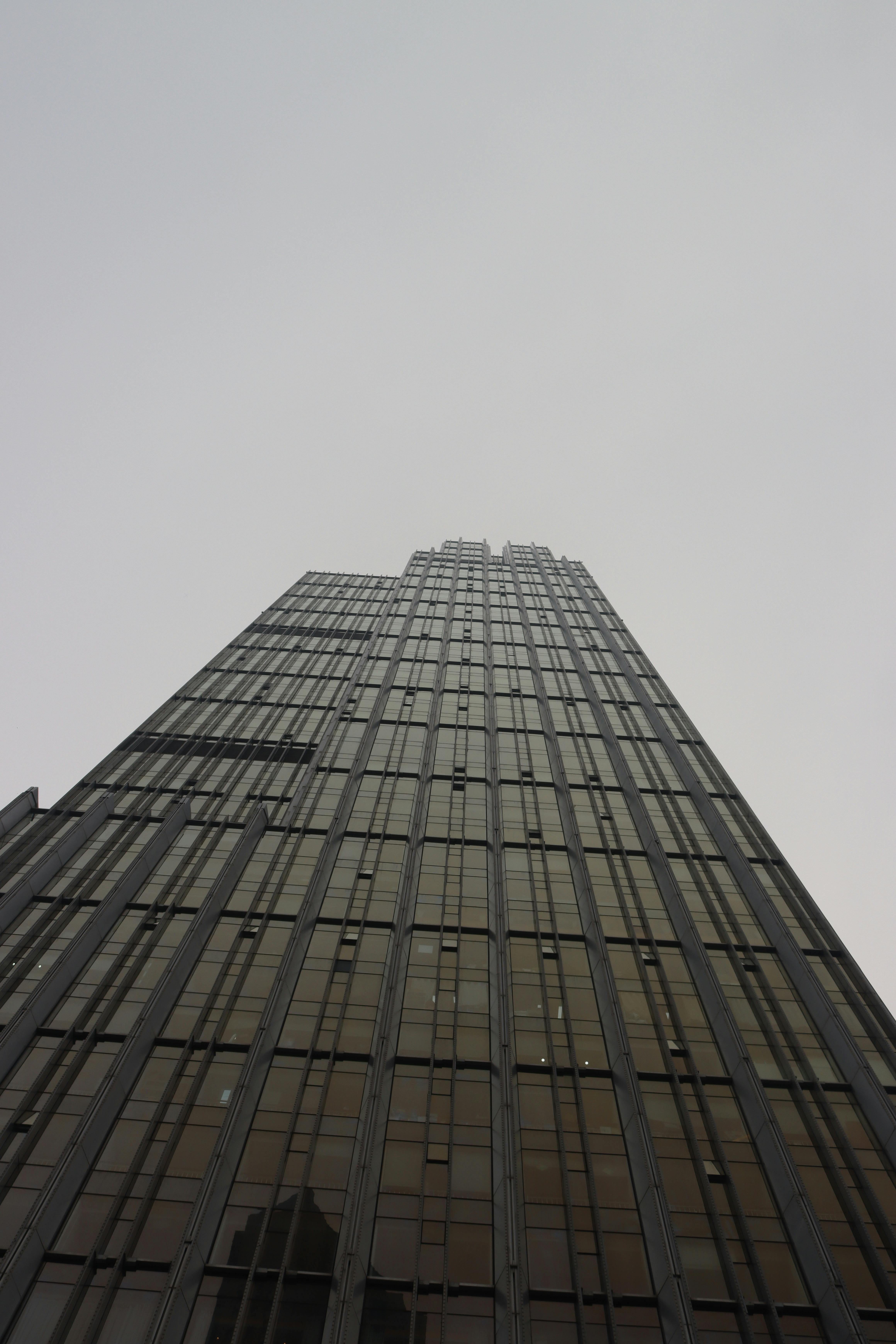 High Rise Building Under a Foggy Sky · Free Stock Photo