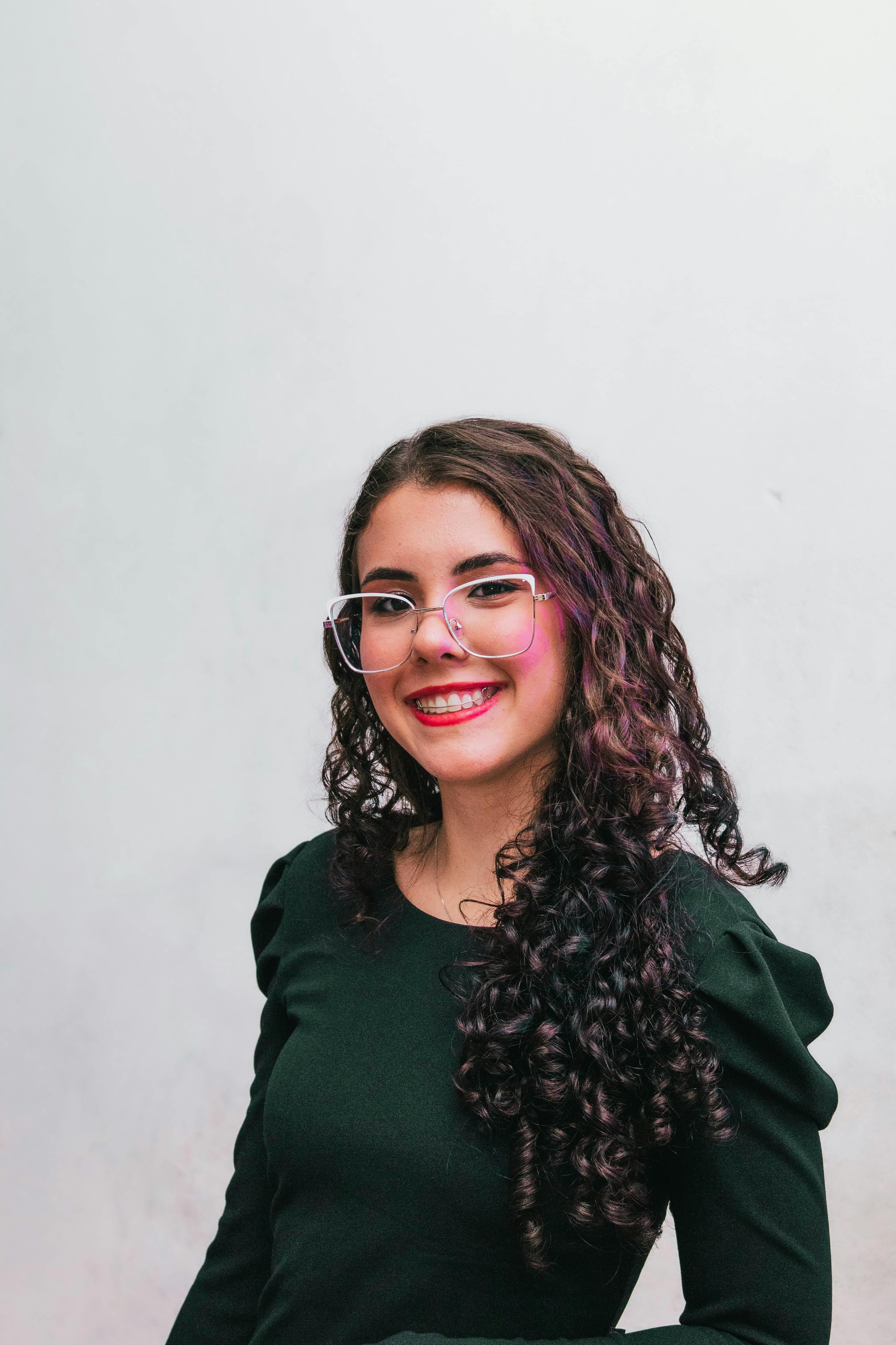 A Woman in Green Long Sleeves Wearing Eyeglasses · Free Stock Photo