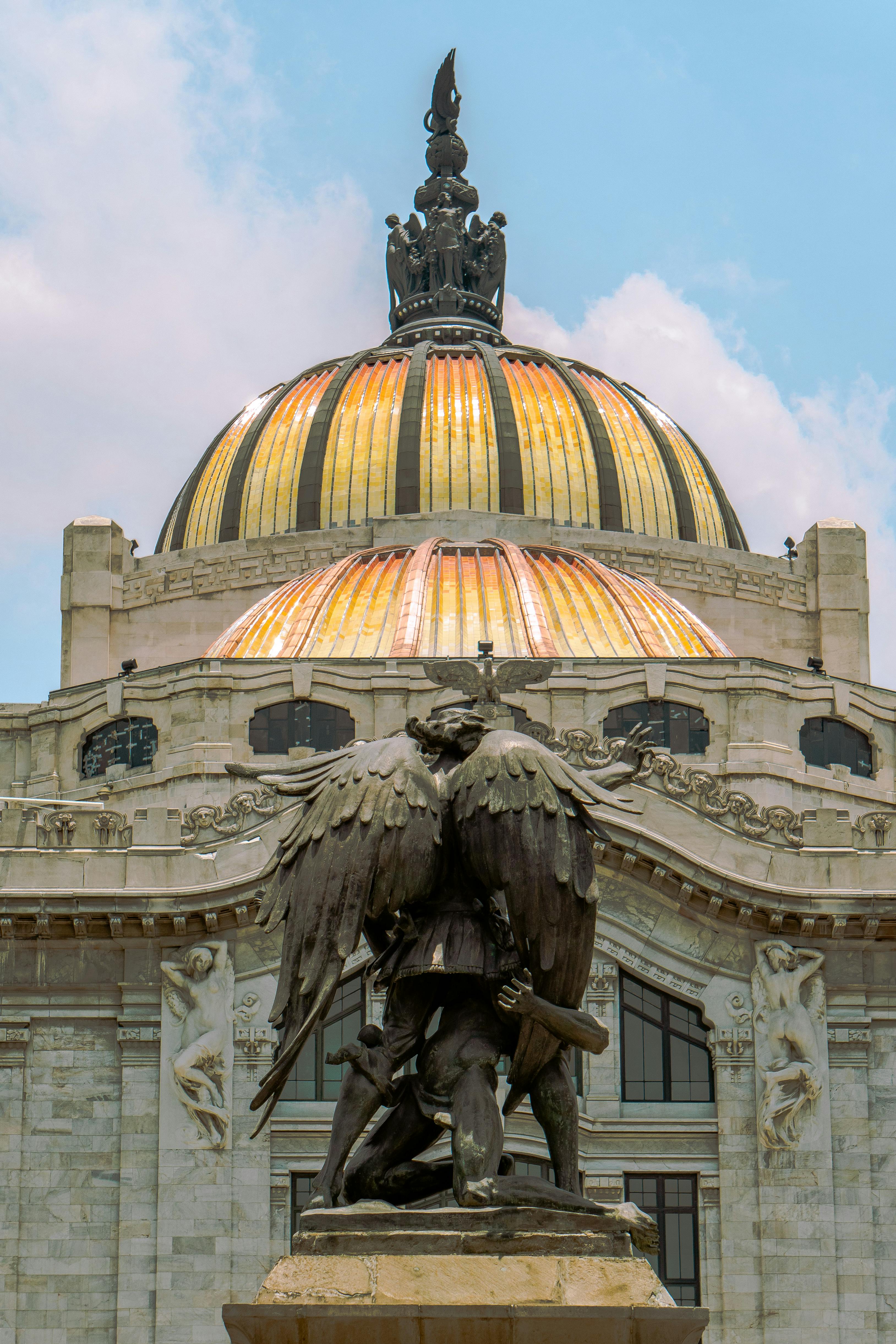 A Statue and Facade of the Palacio de Bellas Artes in Mexico City ...