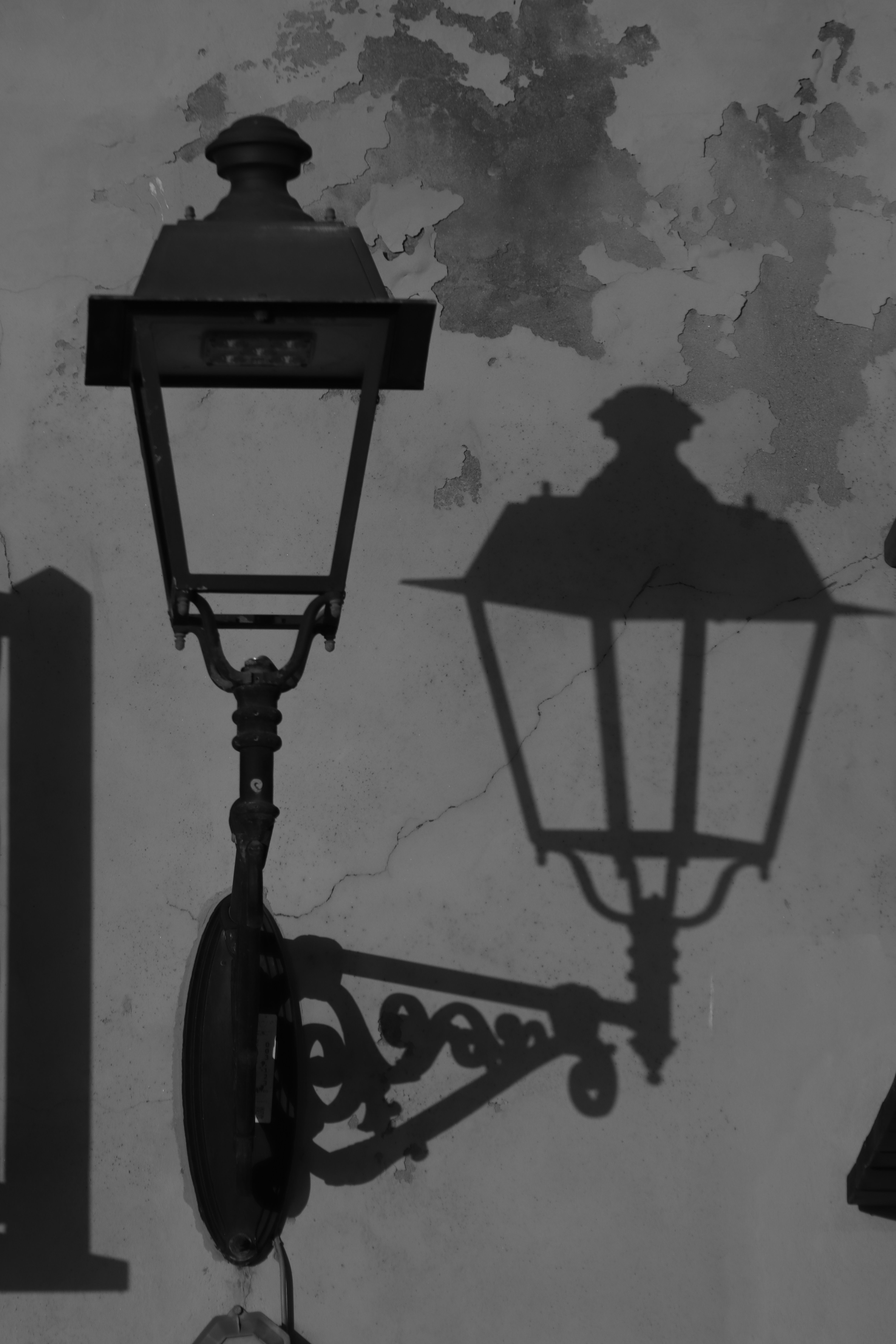 Lamp Post Near White Wall in Close-up Photography · Free Stock Photo