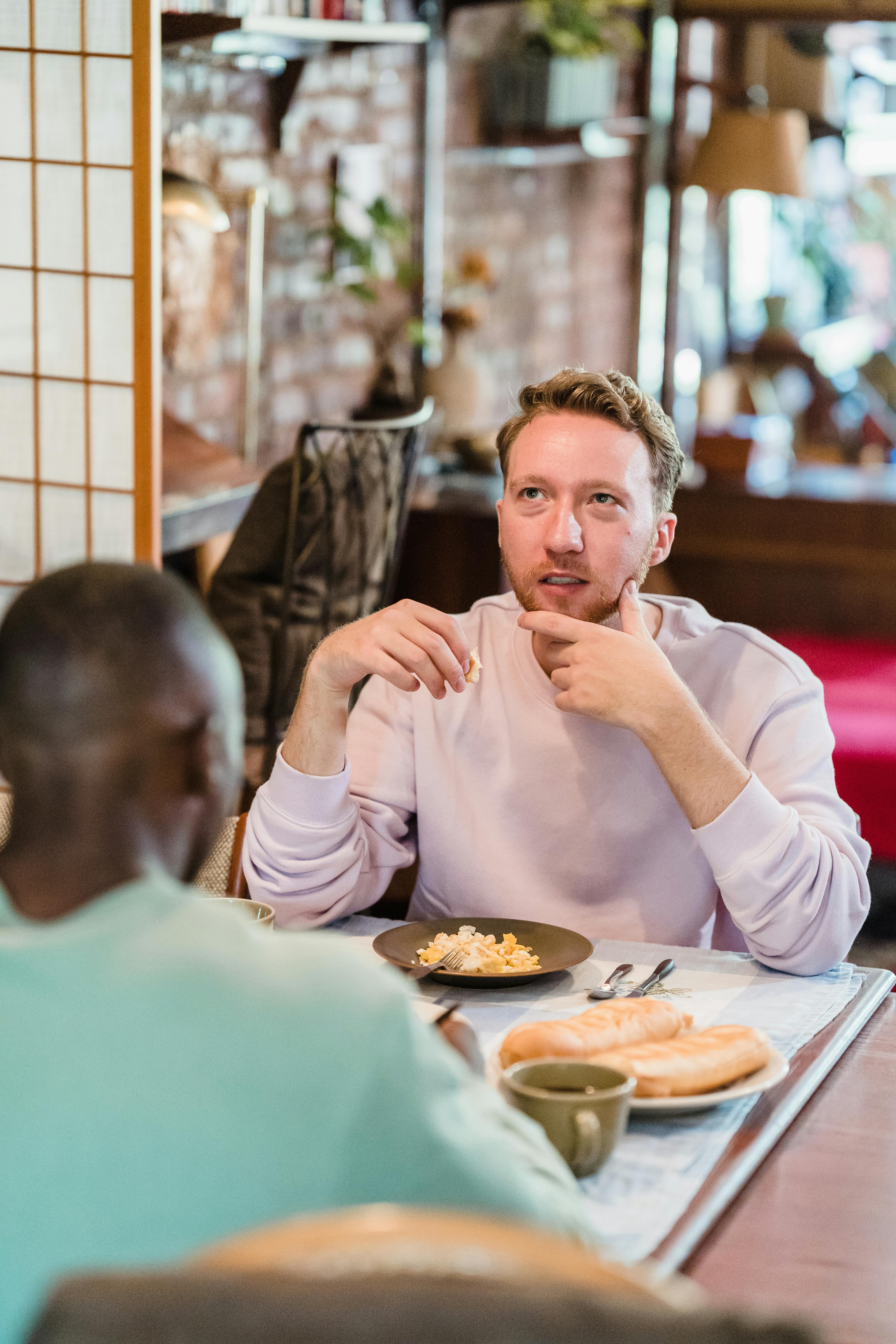 Man Eating in a Restaurant by the Street · Free Stock Photo