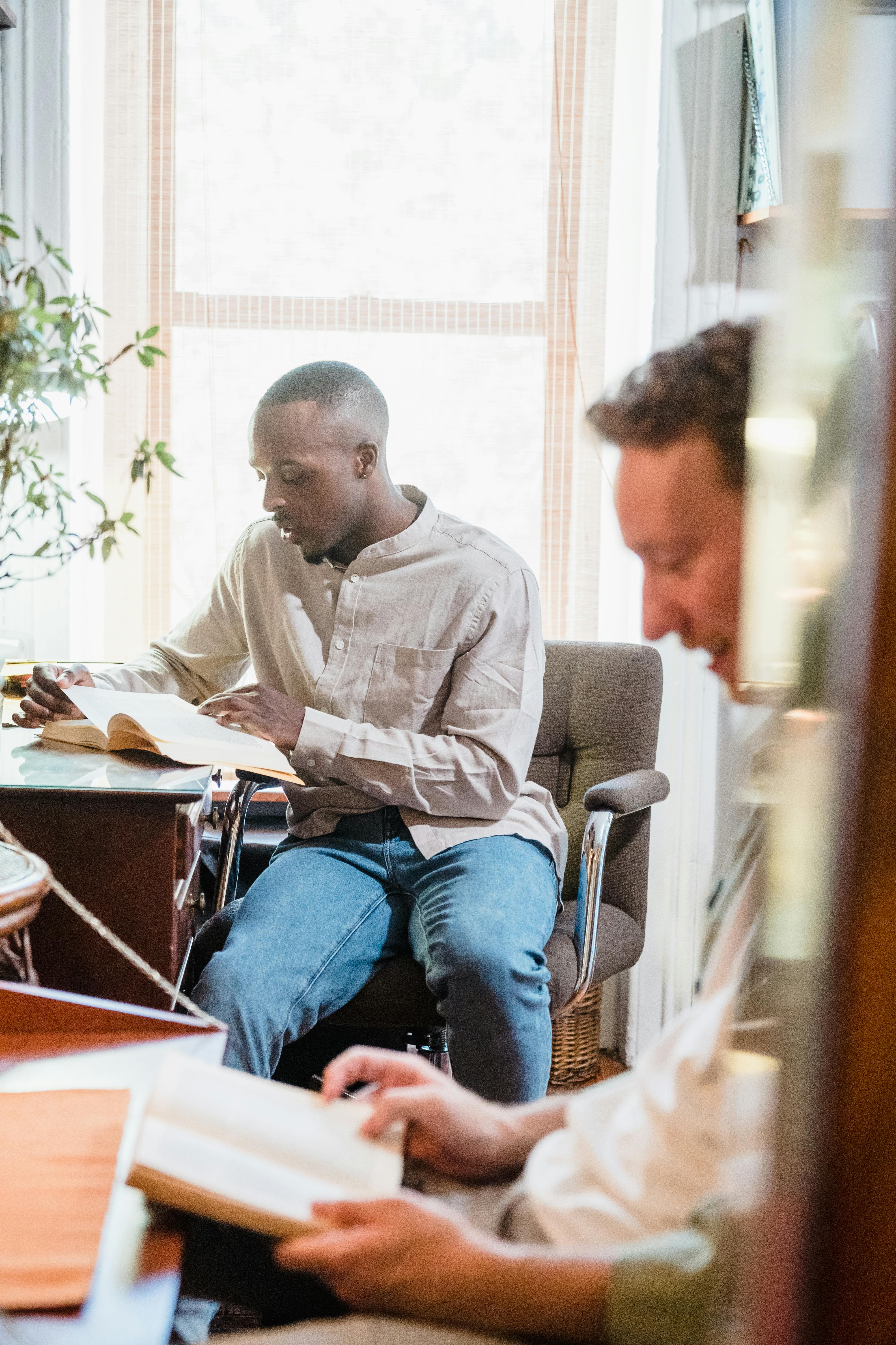 Two Men Reading Books in a Room · Free Stock Photo