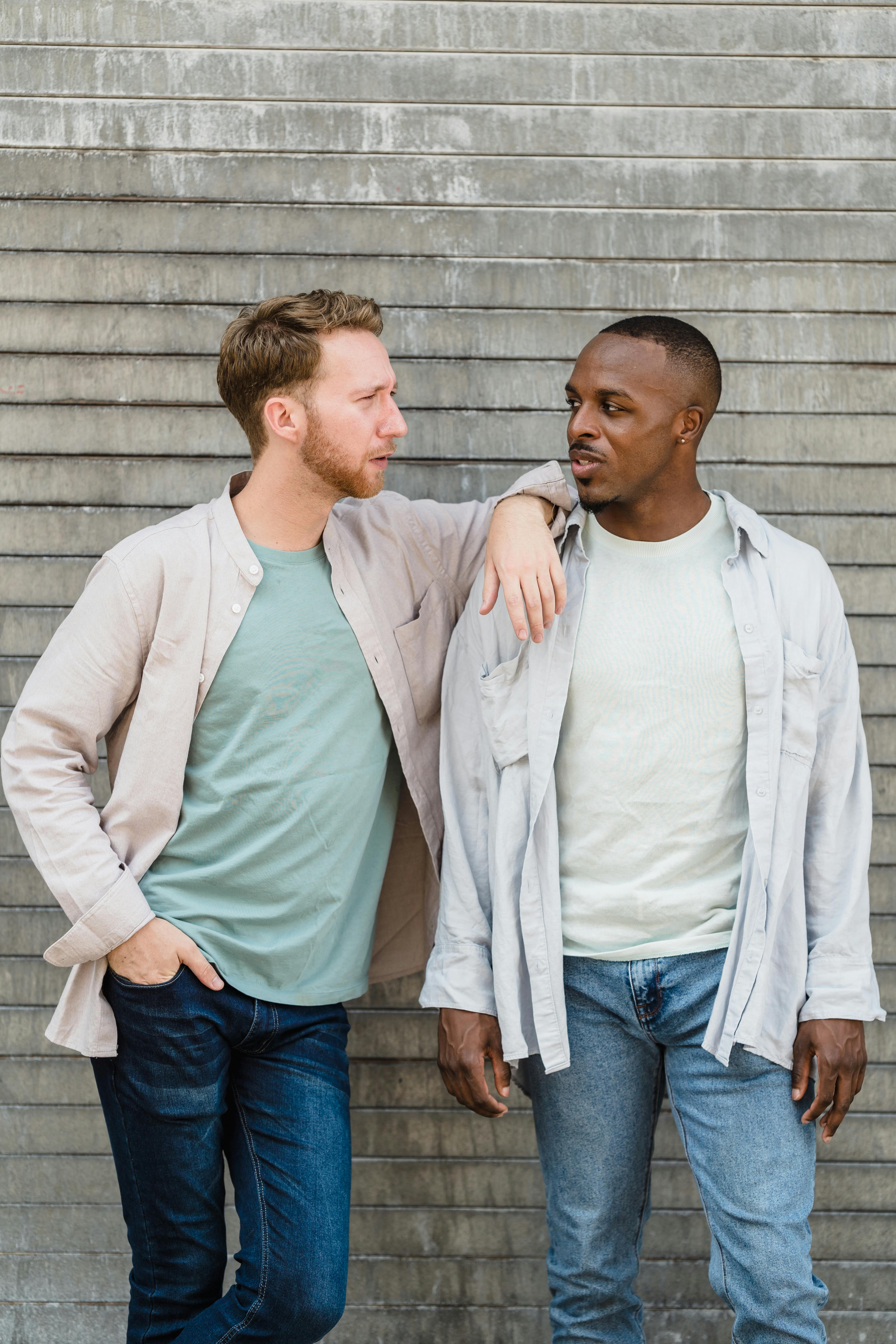 Two Men Standing by the Wall · Free Stock Photo