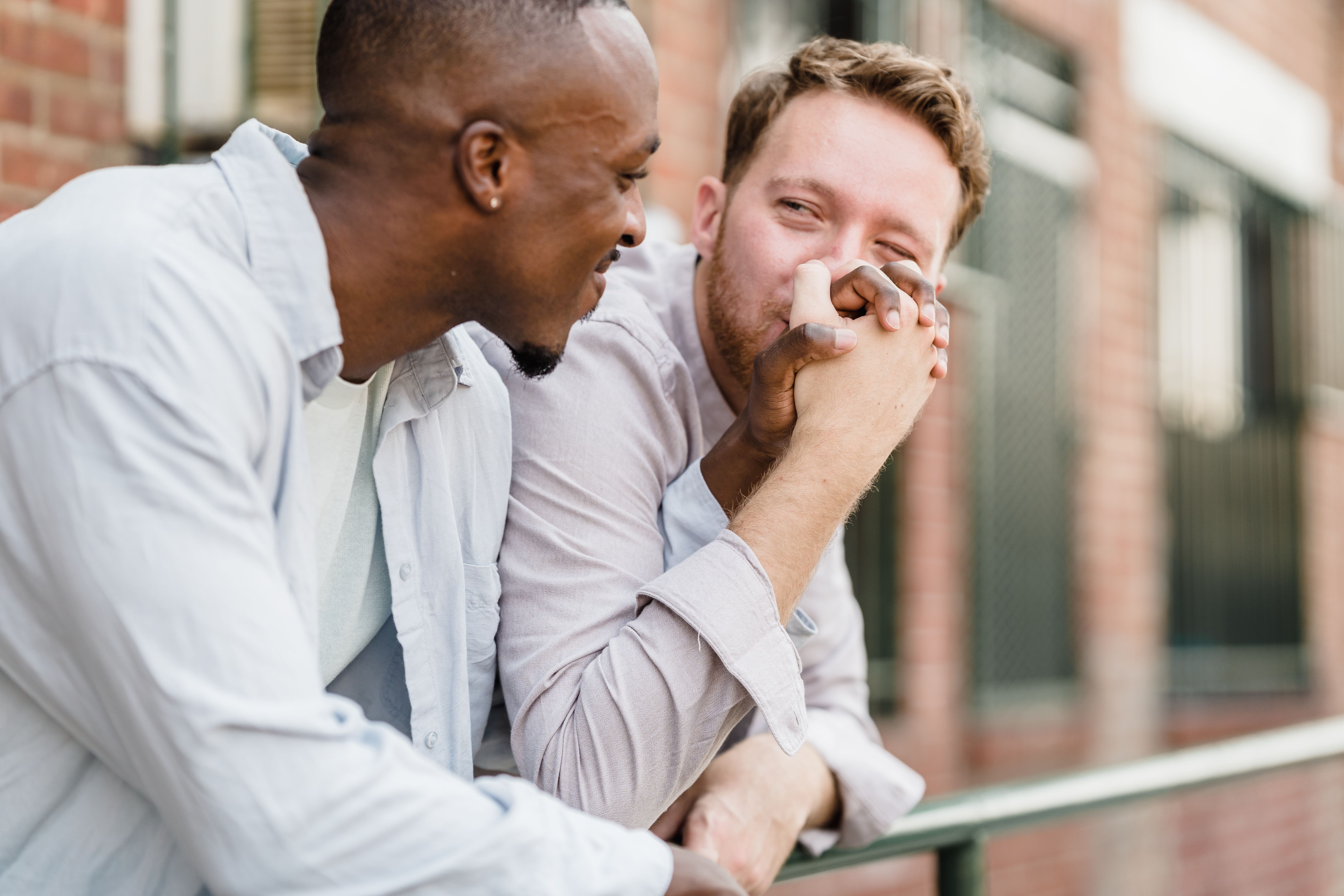 Two Young Men Wearing Suits Bowing Heads Towards Each Other · Free ...