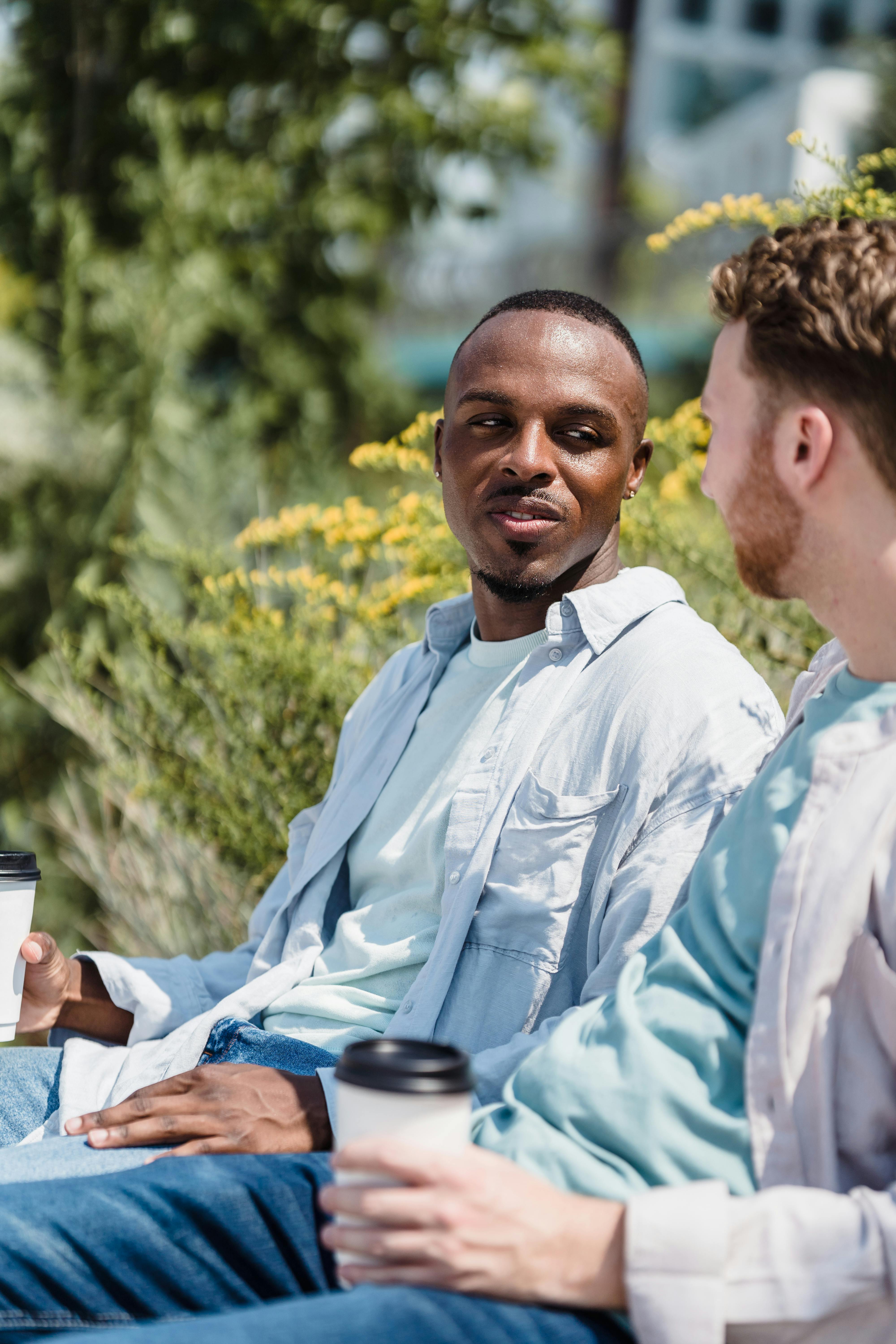 Two Men Sitting and Talking · Free Stock Photo