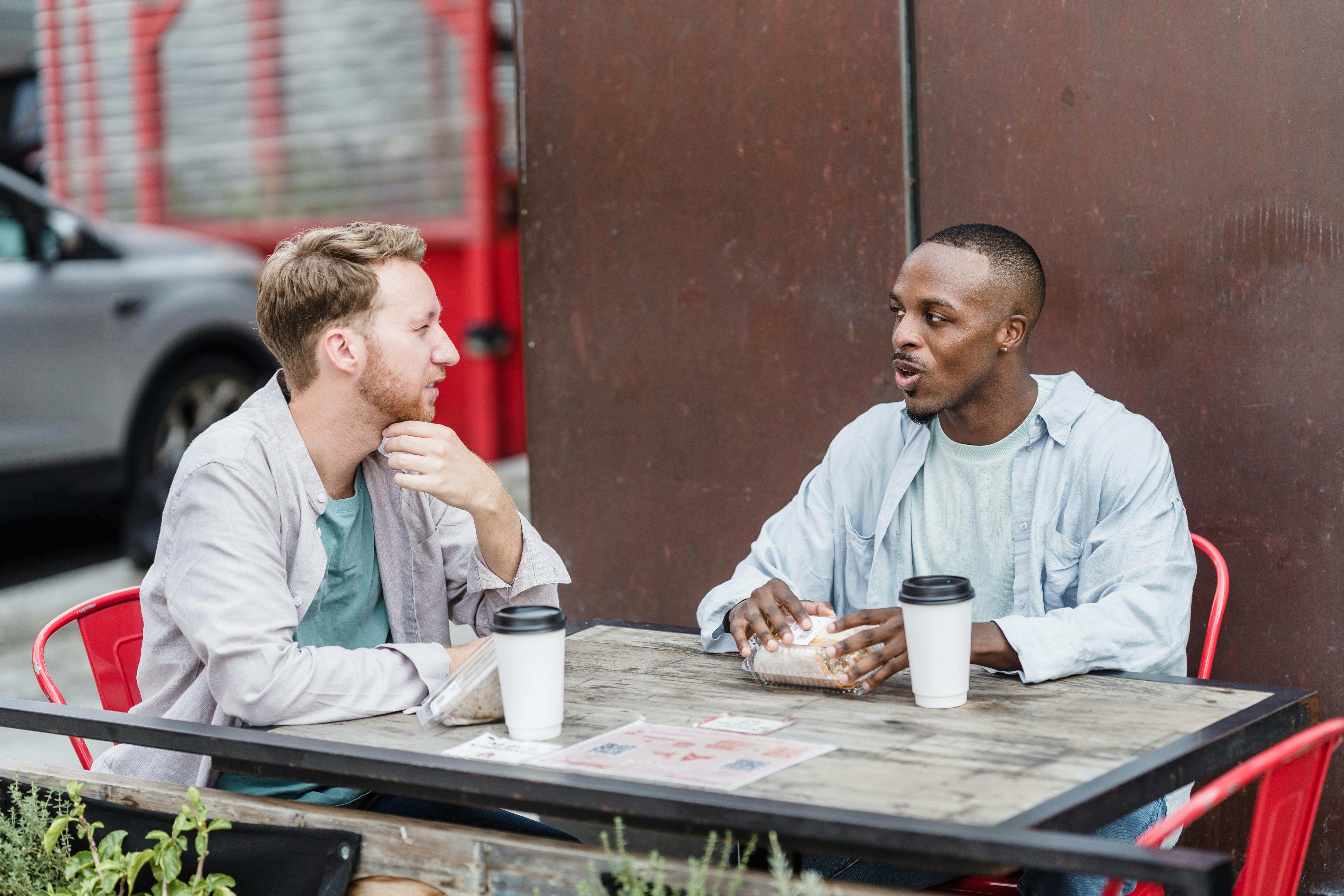 Two Men Sitting at the Table · Free Stock Photo