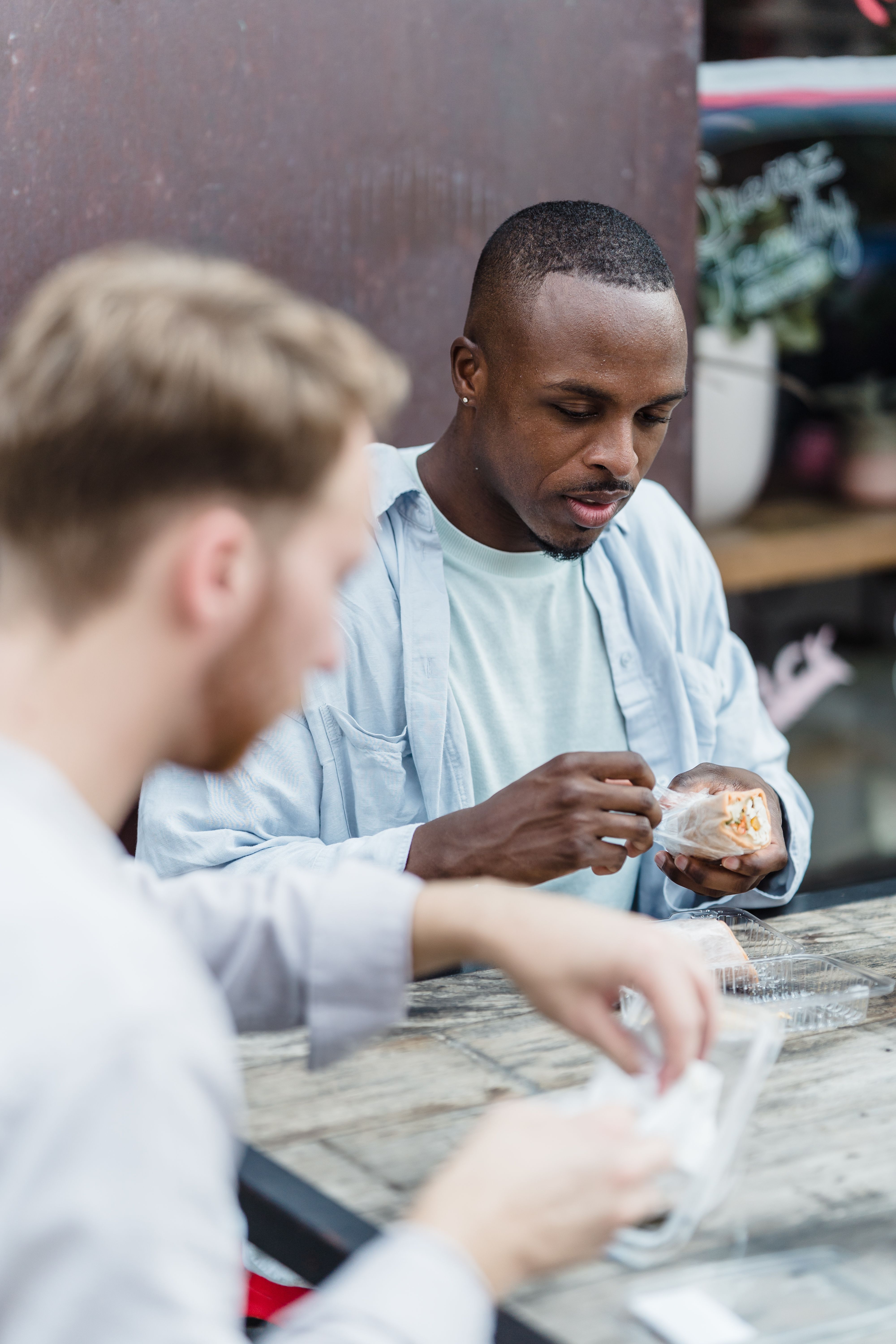 Two Men Sitting at the Table · Free Stock Photo